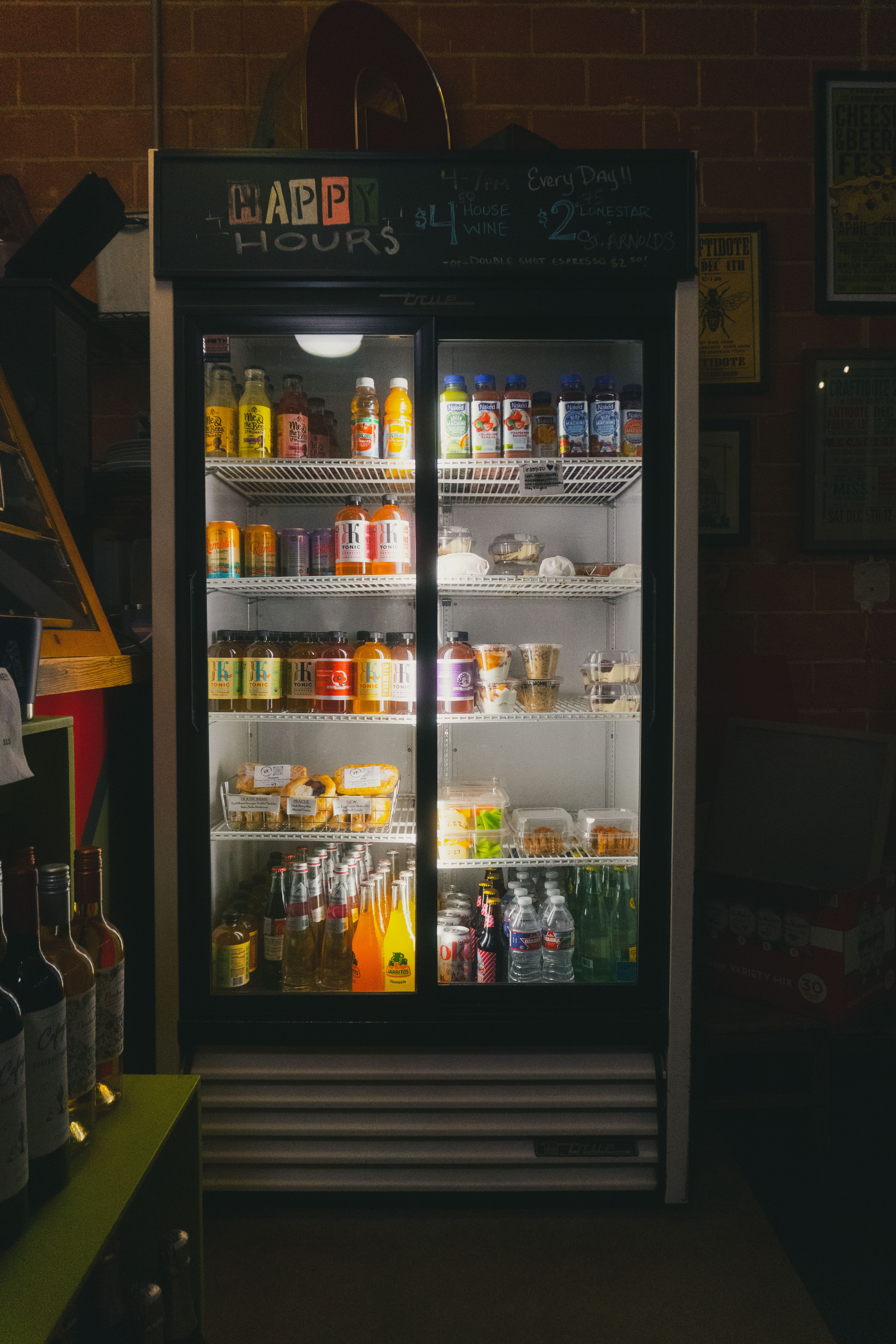 Fully stocked beverage cooler in Houston shop · Free Stock Photo