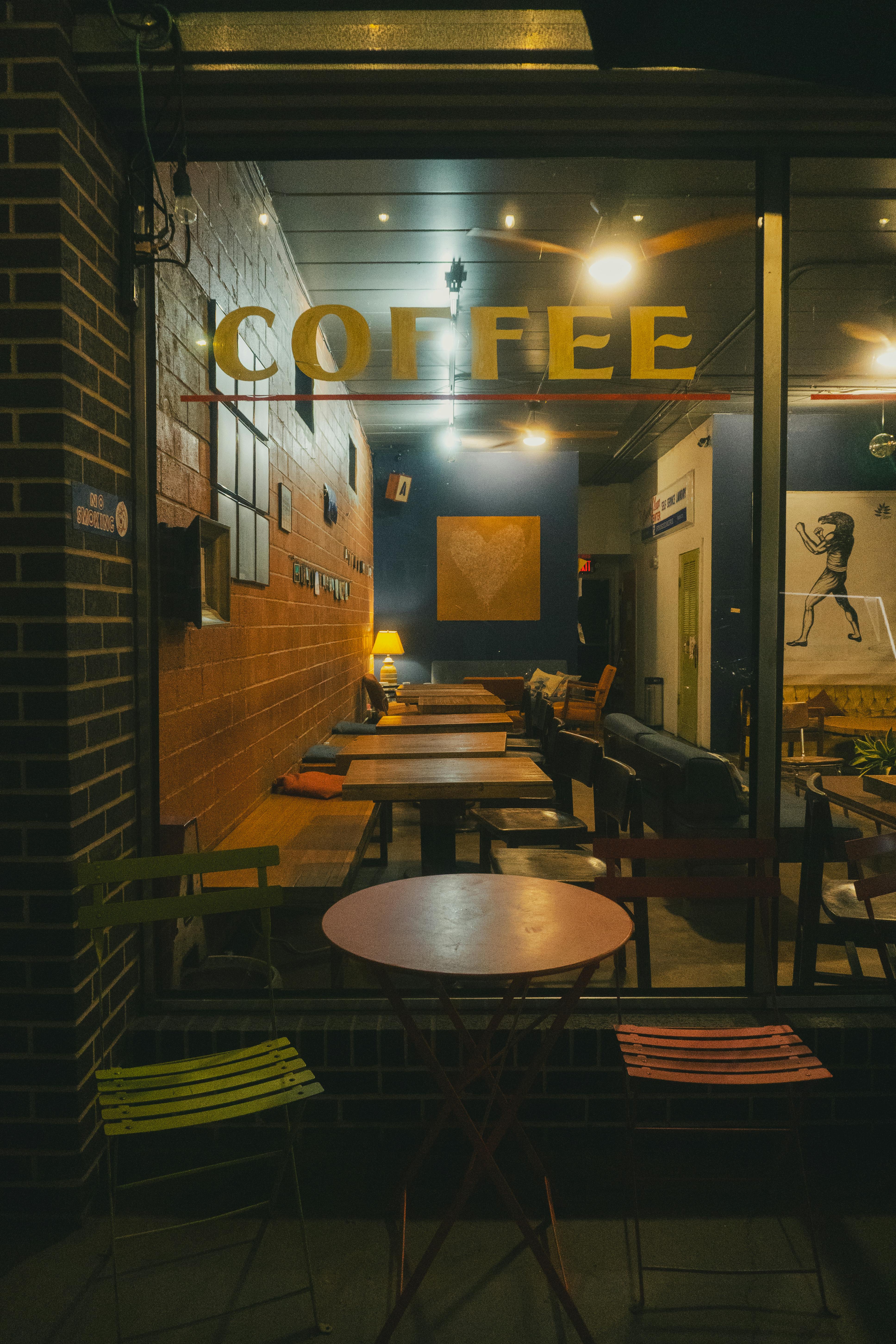 Cozy Coffee Shop Exterior at Night in Houston · Free Stock Photo