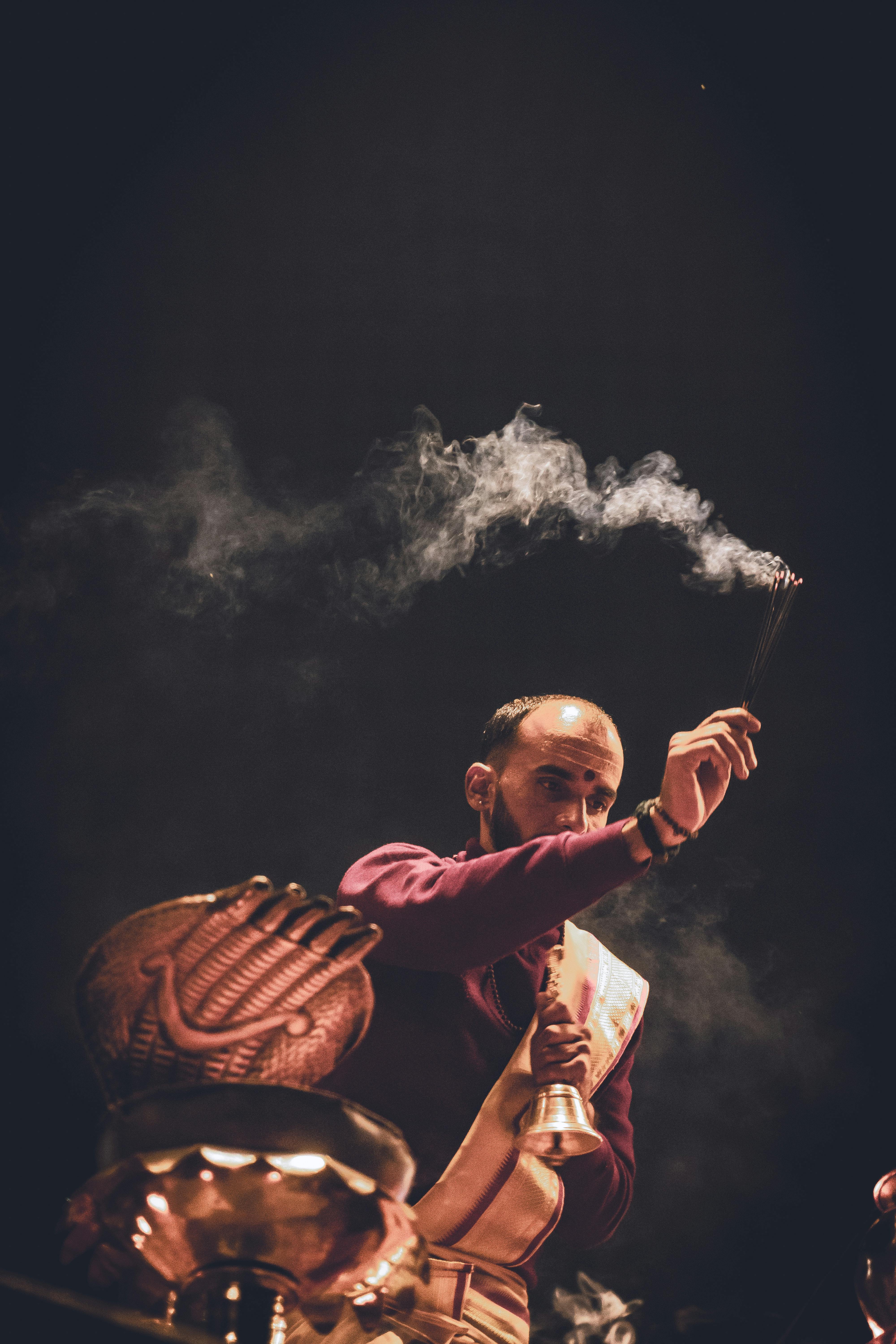 Priest Performing Ritual with Incense Sticks · Free Stock Photo
