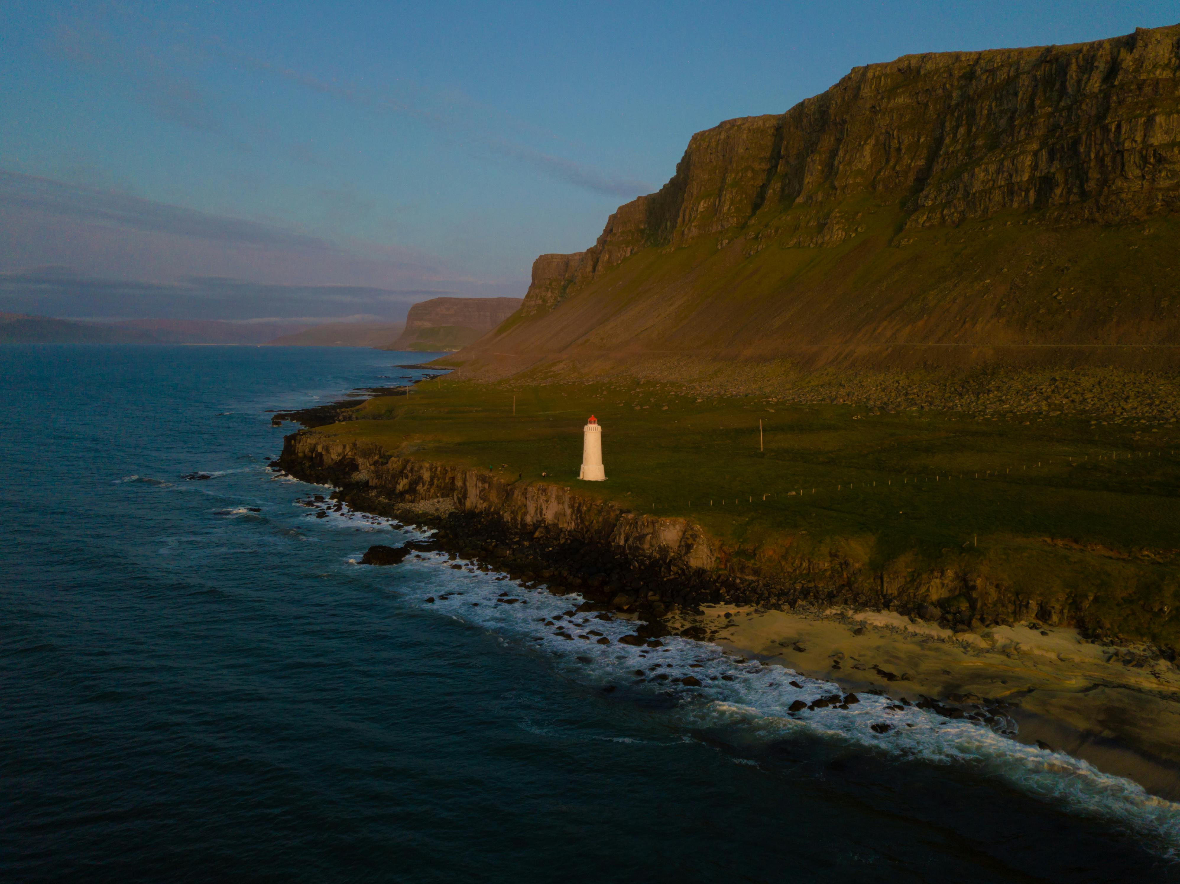 Aerial View of Icelandic Lighthouse at Sunset · Free Stock Photo