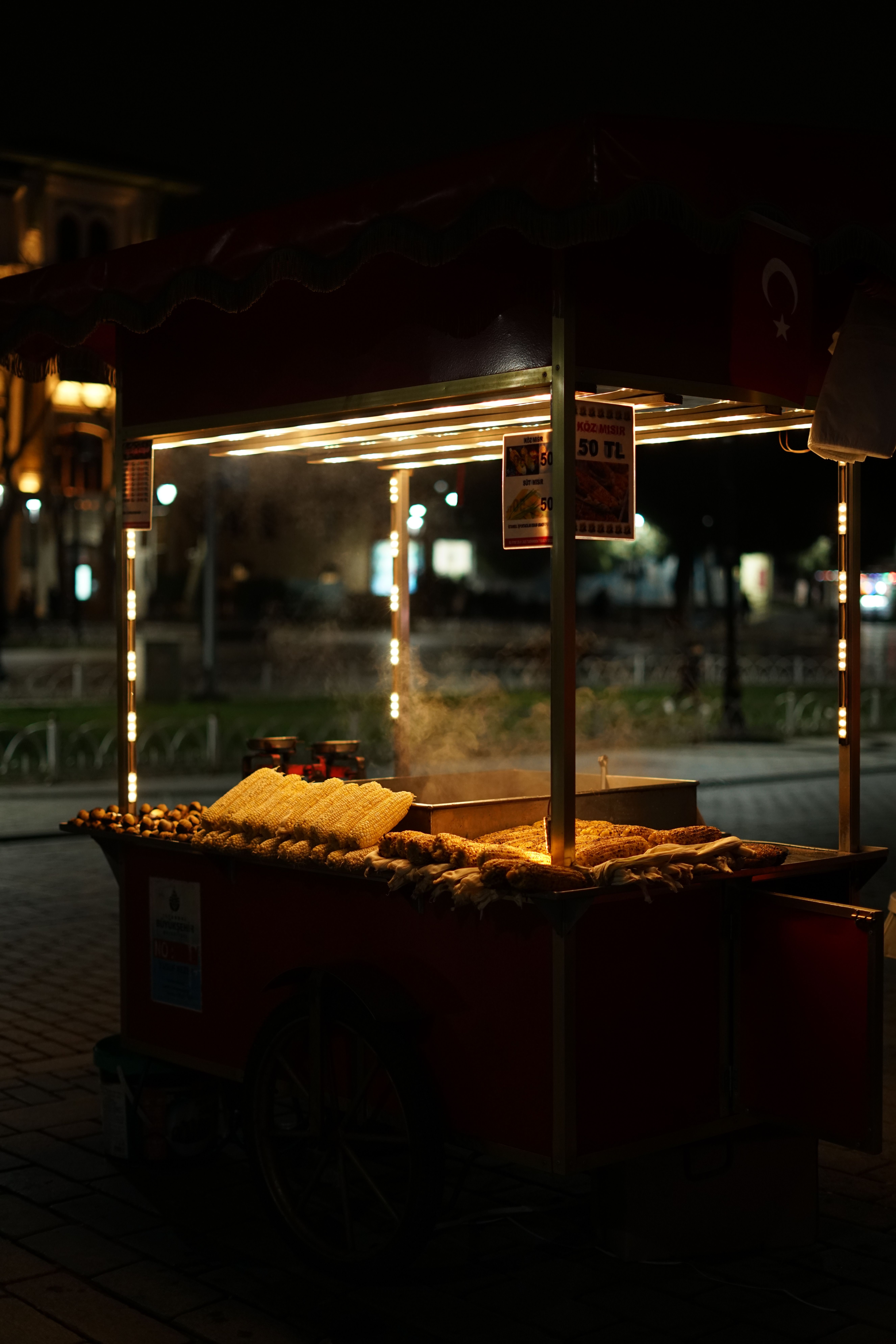 Night Street Food Cart with Grilled Corn · Free Stock Photo