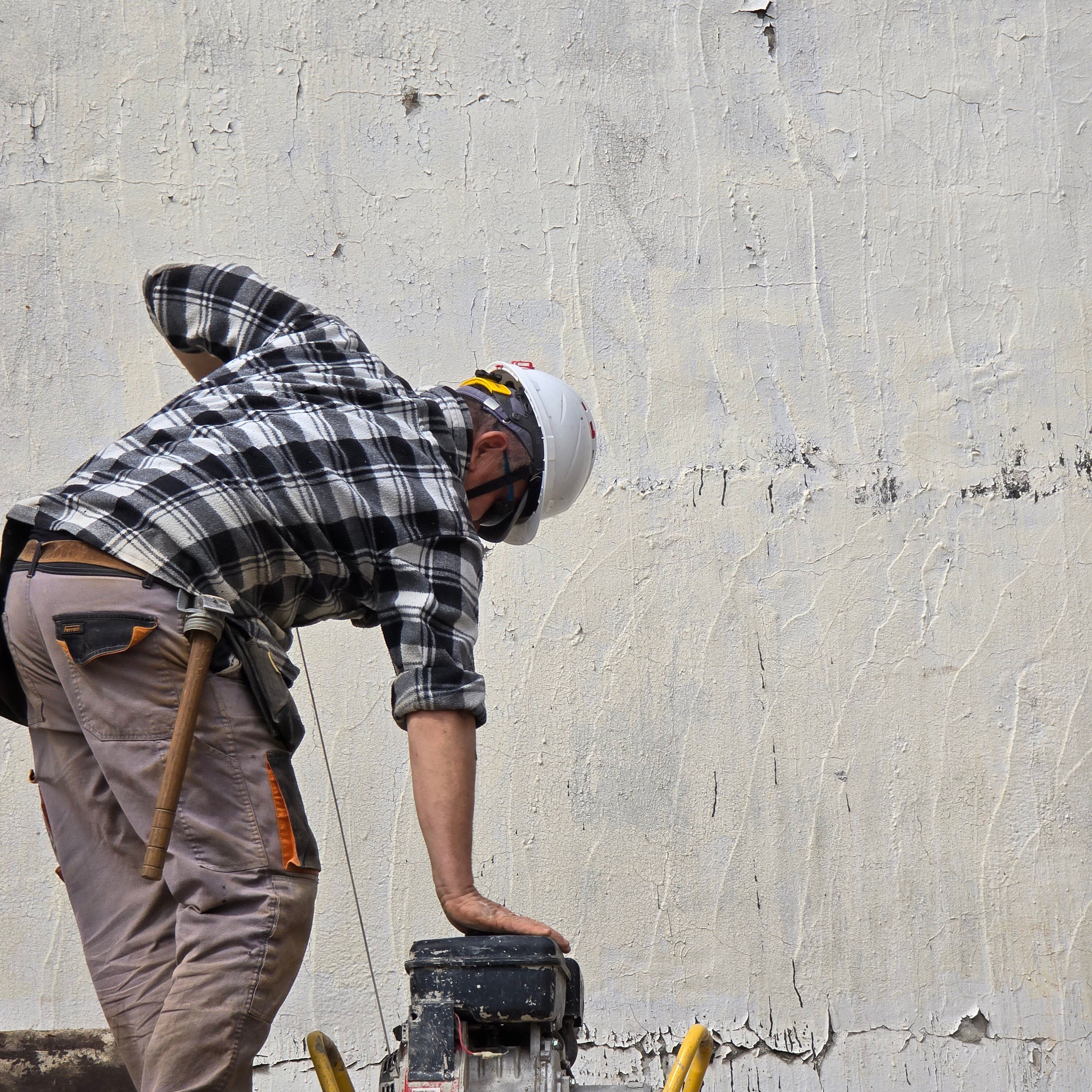 Construction Worker Operating Equipment on Site · Free Stock Photo