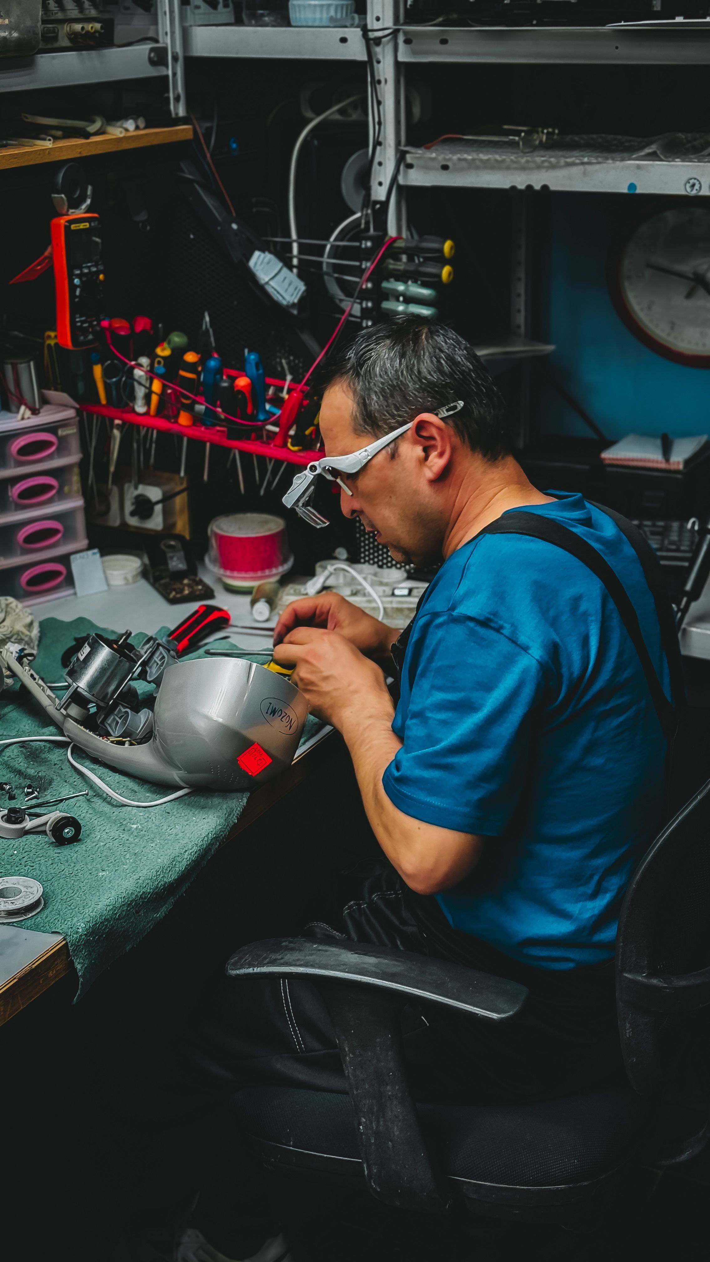 Skilled Technician Repairing Device in Workshop · Free Stock Photo