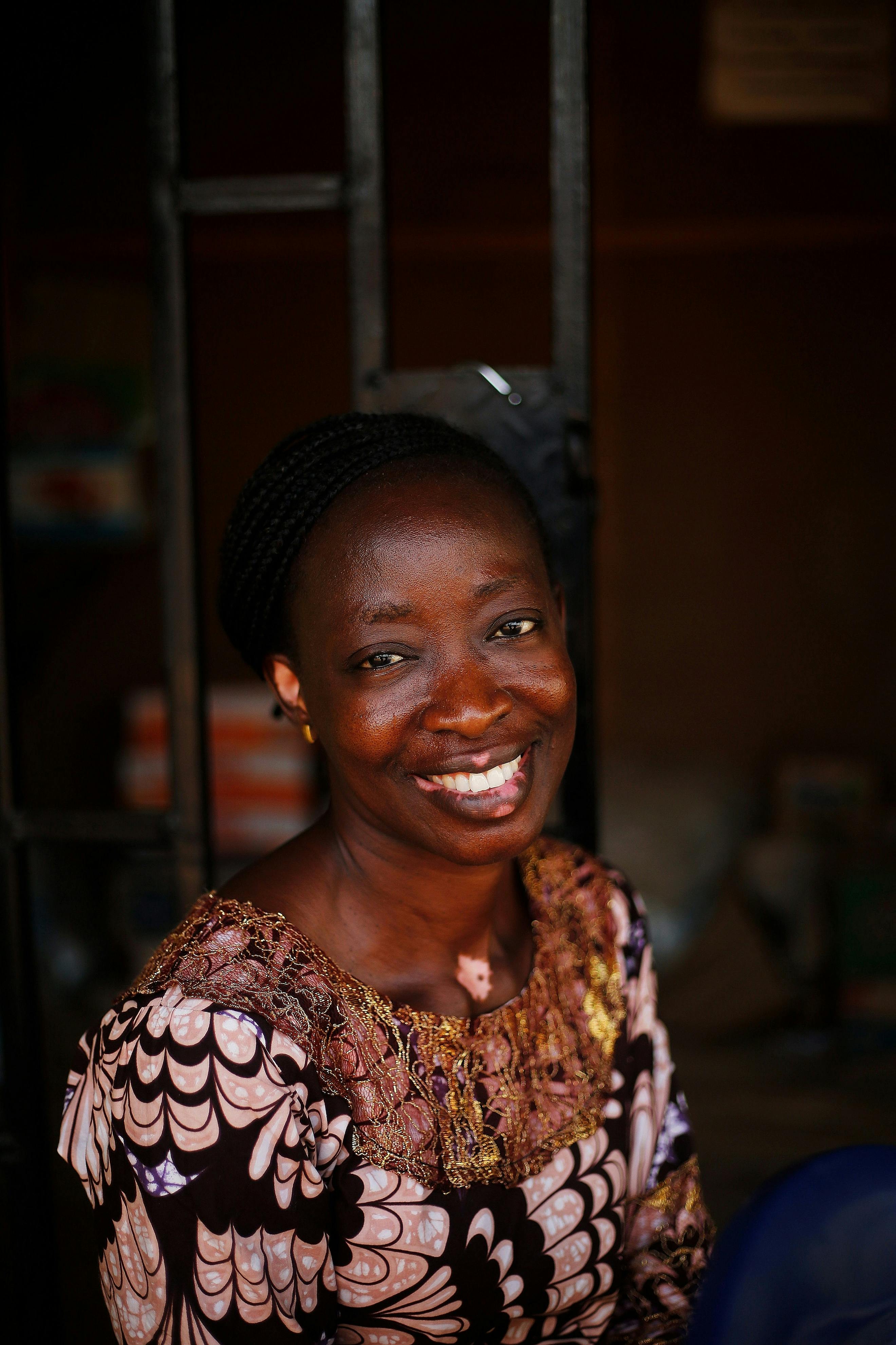 Smiling Woman in Traditional Nigerian Attire · Free Stock Photo