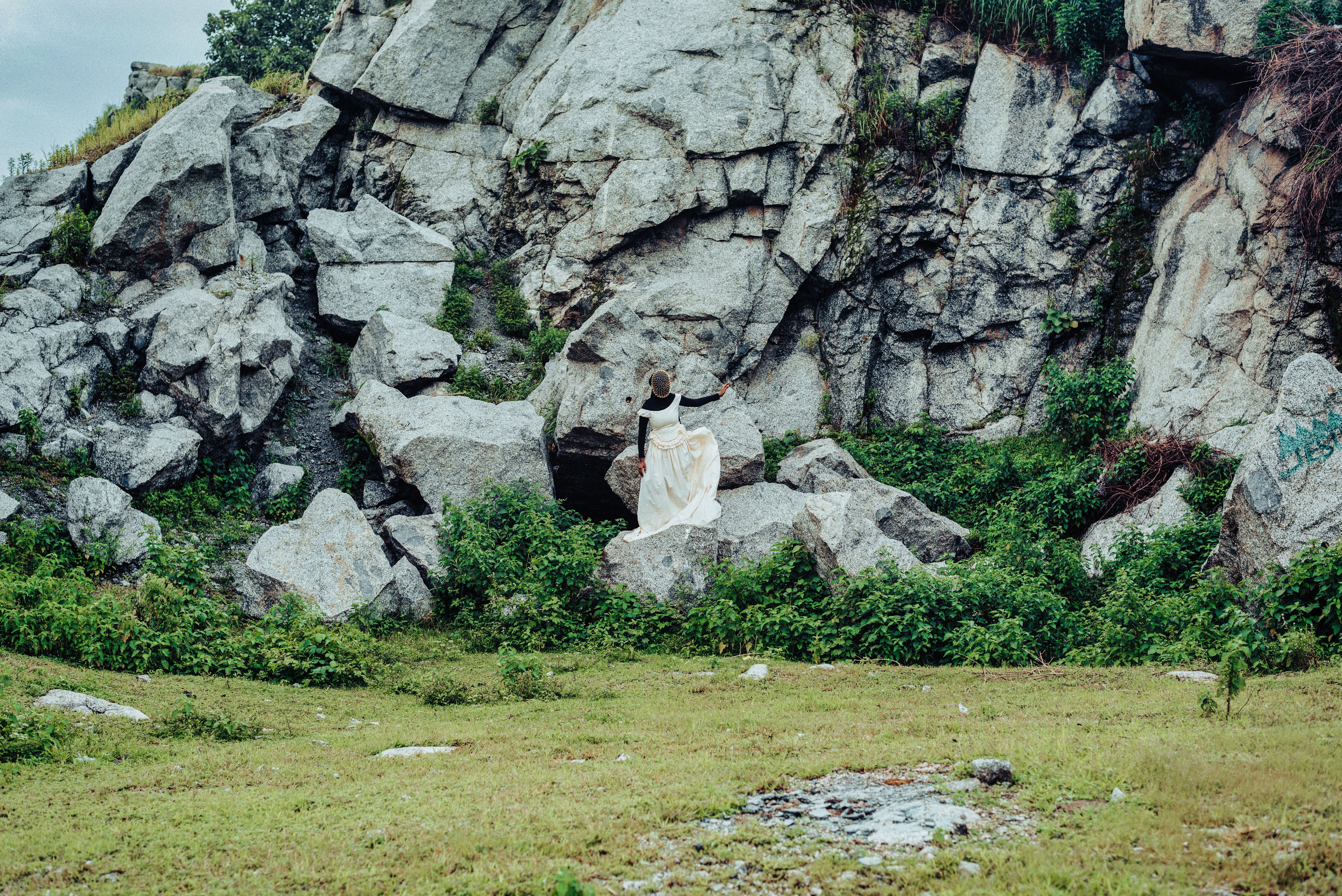 Couple Embracing Near Rocky Terrain Outdoors · Free Stock Photo