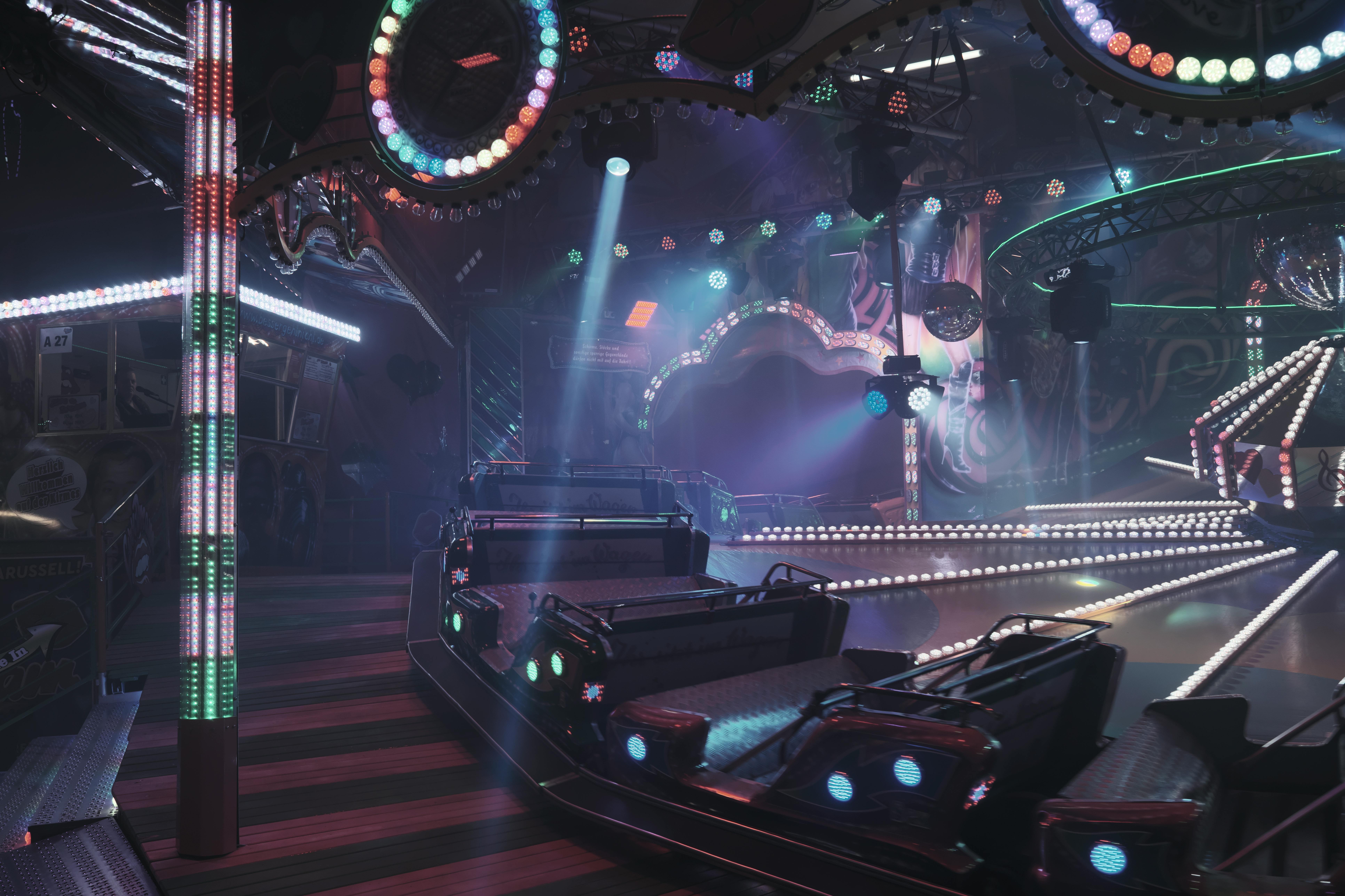 Vibrant Indoor Amusement Park Ride at Night · Free Stock Photo