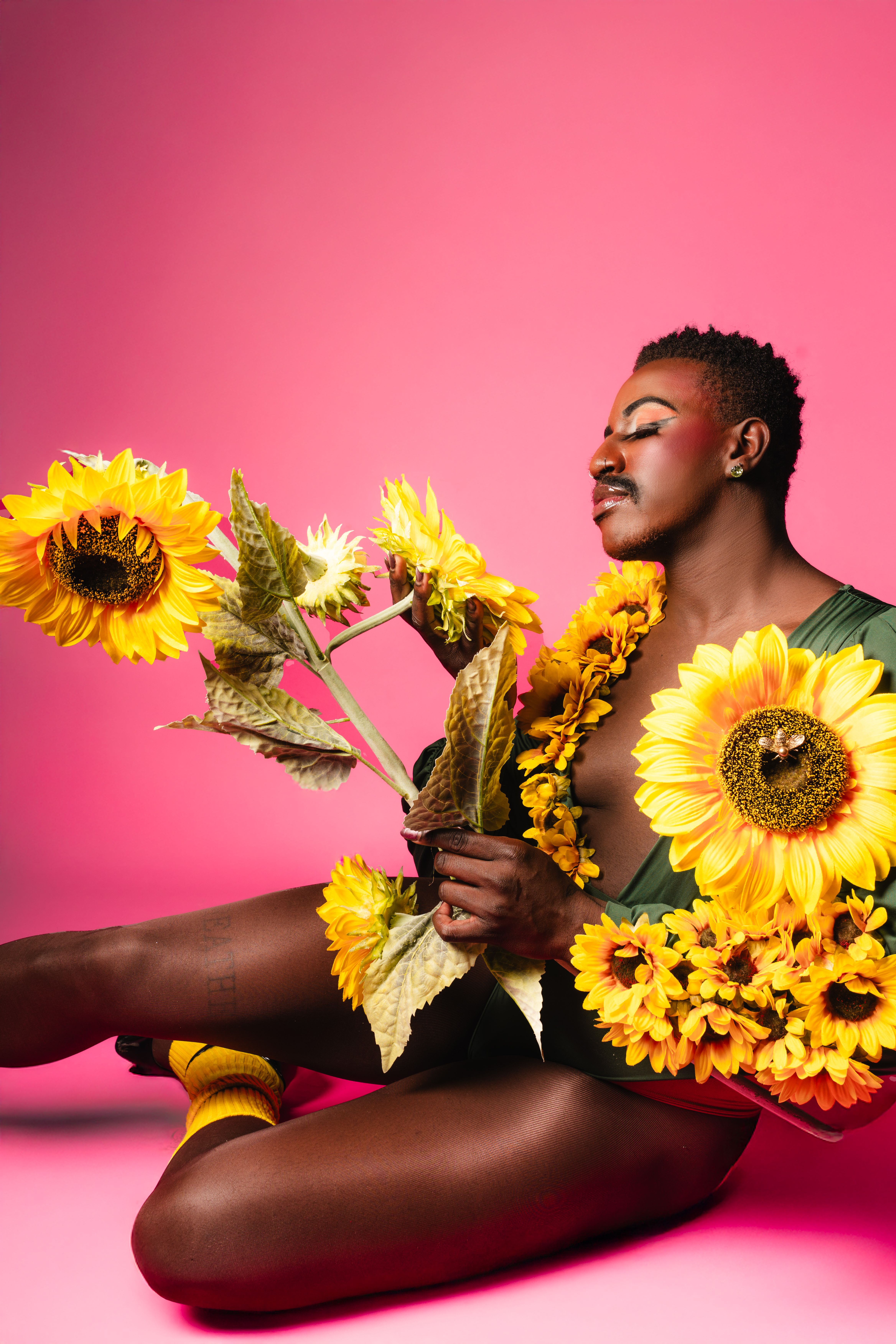 Artistic Portrait of Man with Sunflowers in Studio · Free Stock Photo