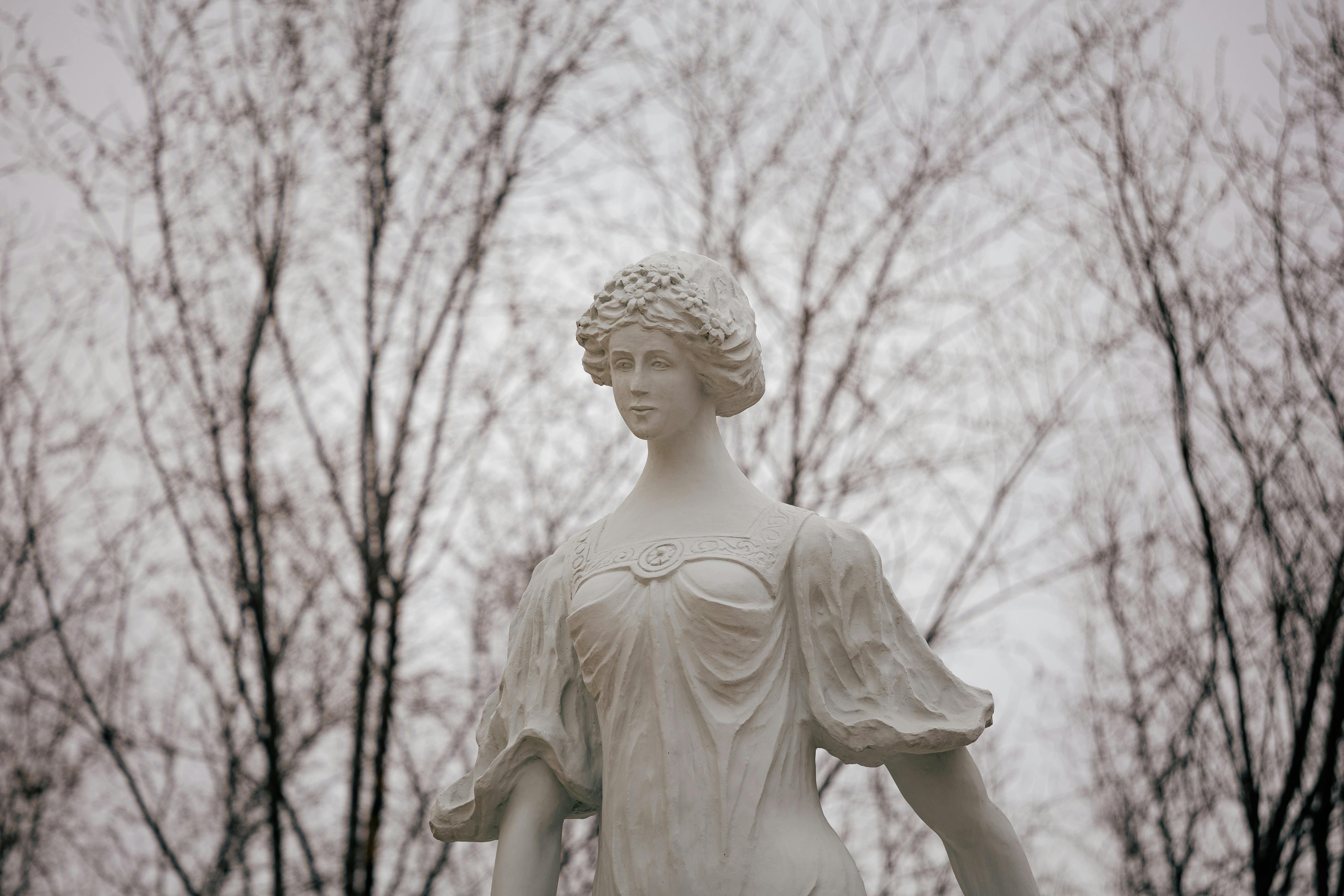 Classical Marble Statue in a Leafless Winter Setting · Free Stock Photo
