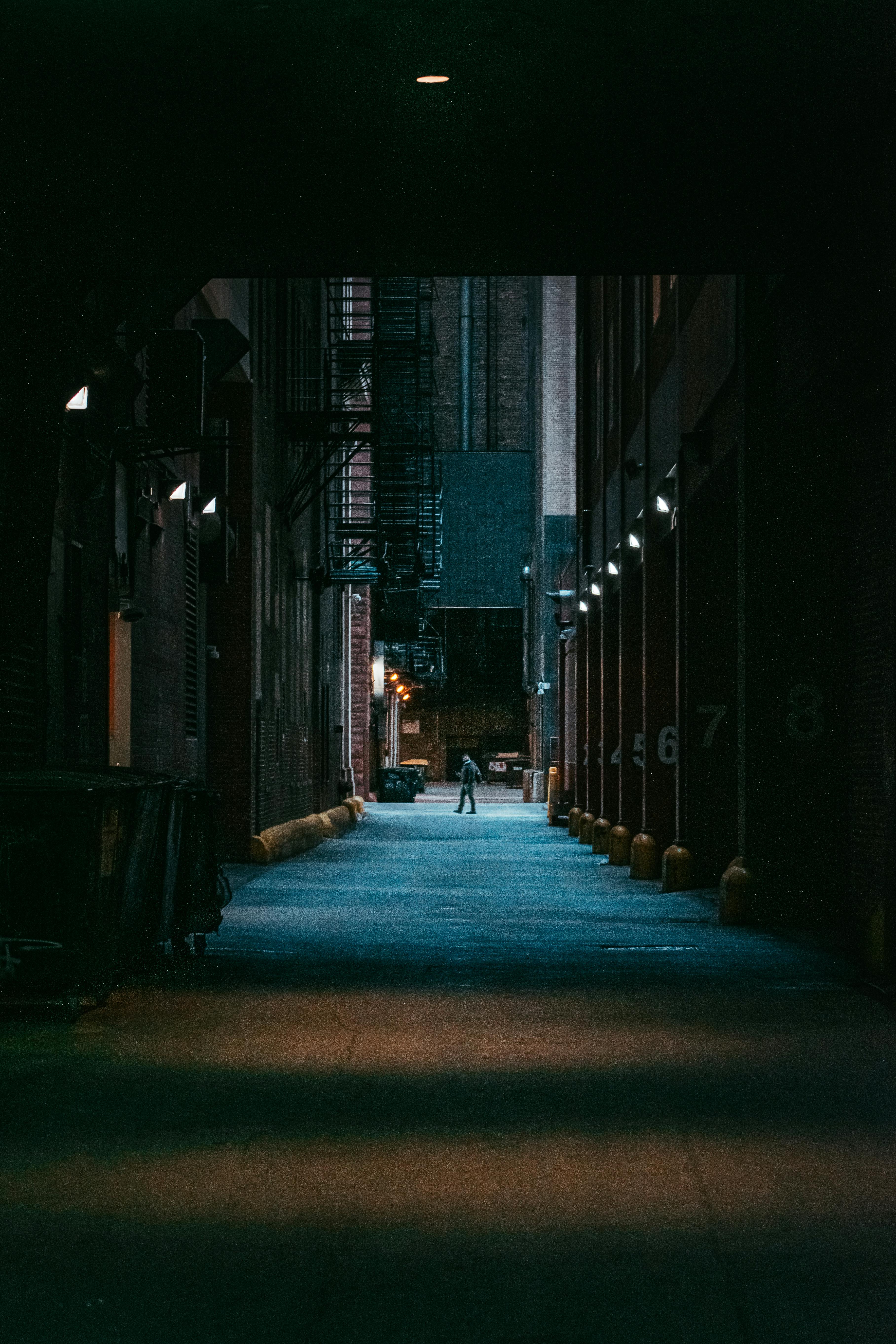 Moody Chicago Alley at Night with Lone Figure · Free Stock Photo