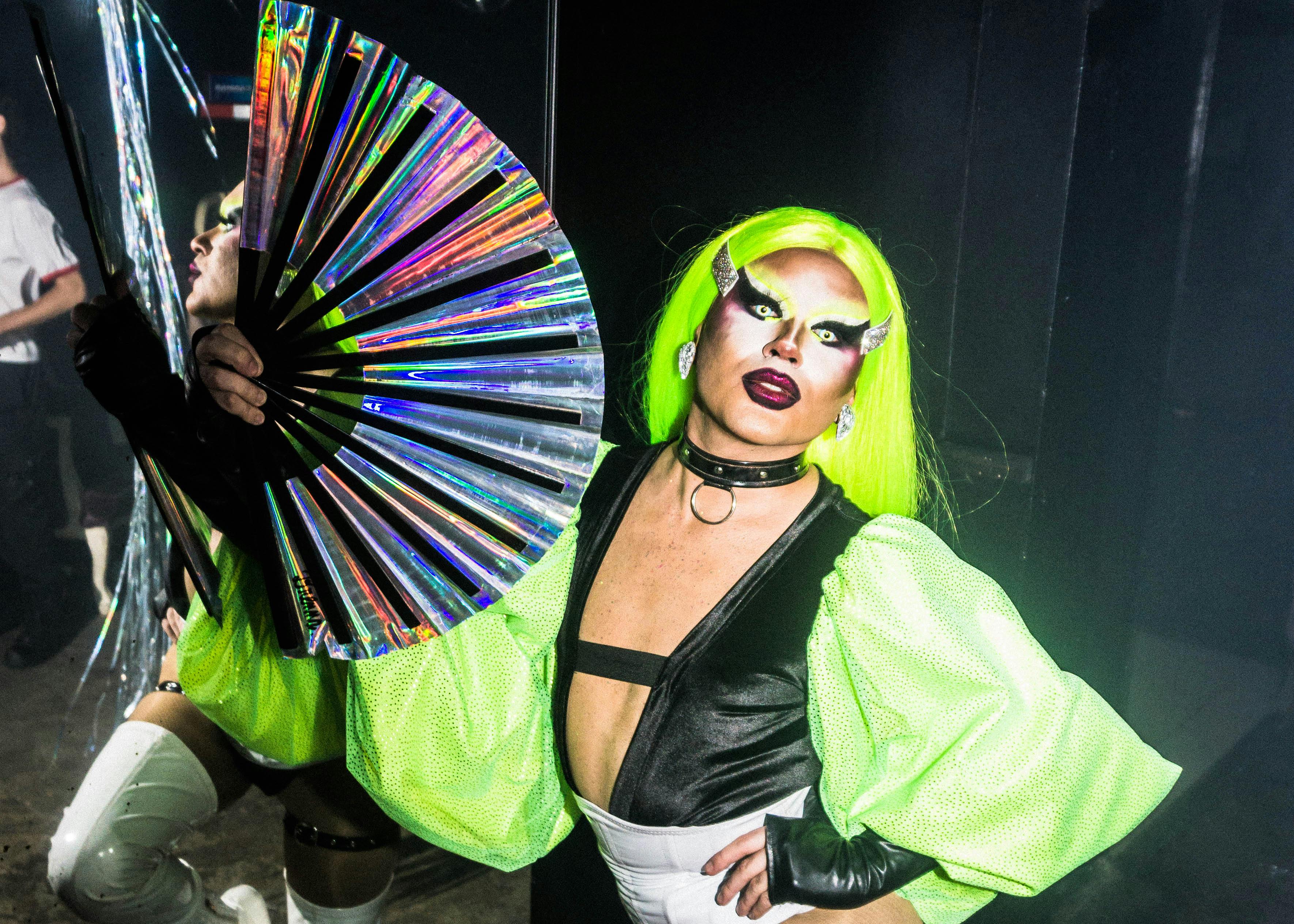 Vibrant Drag Performer with Neon Green Hair · Free Stock Photo