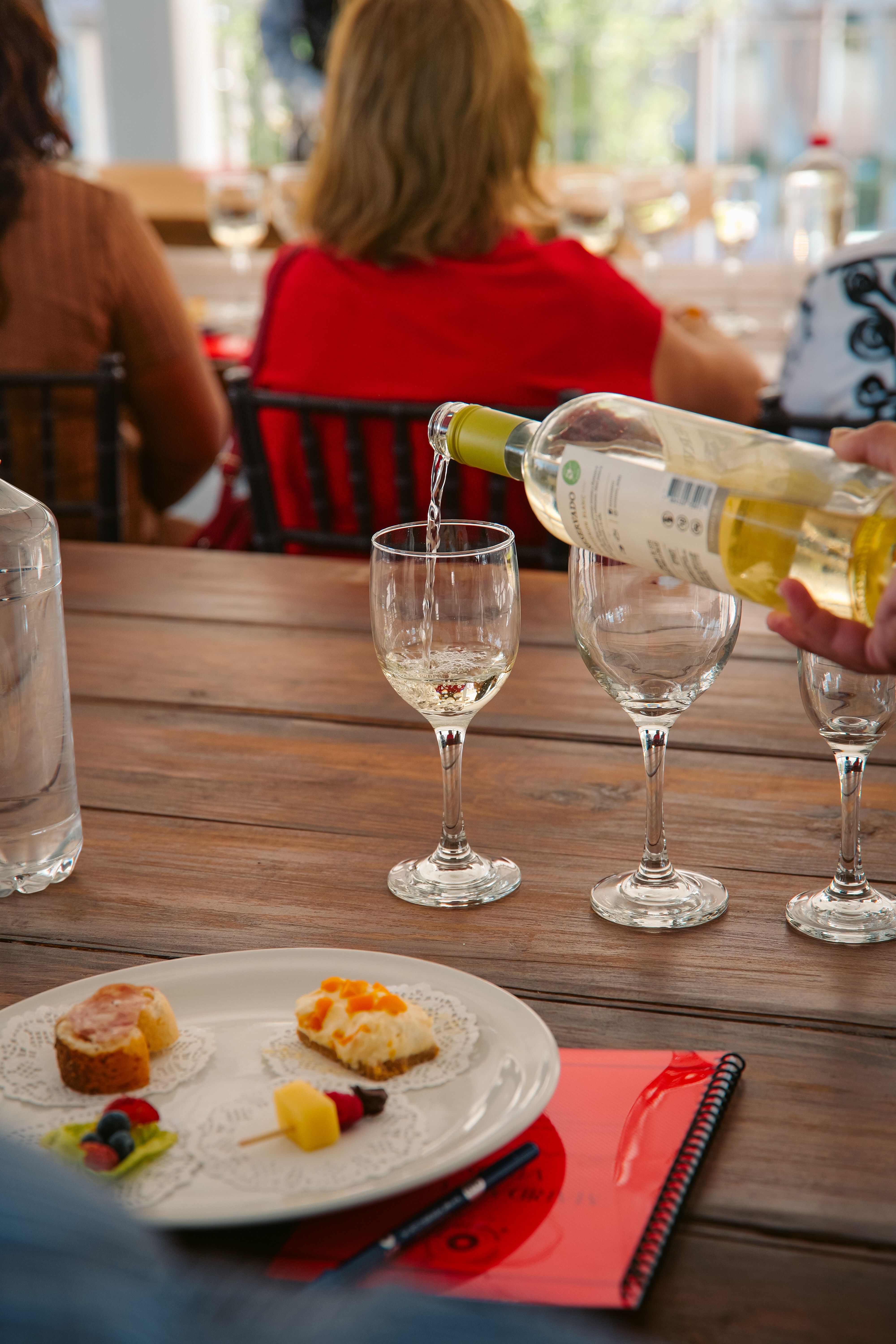 Wine Pouring at a Social Gathering Event · Free Stock Photo