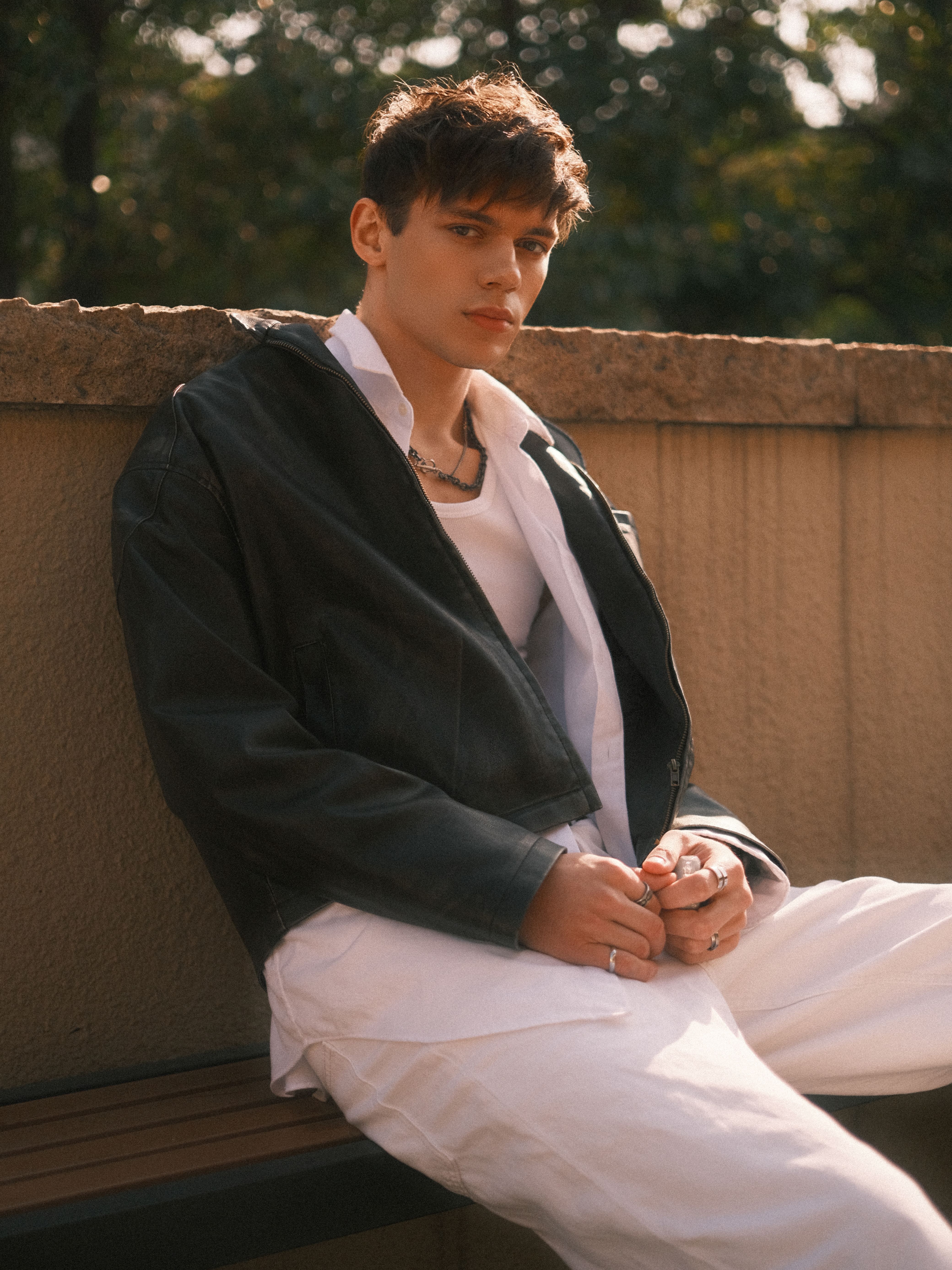 Stylish Young Man Relaxing Outdoors in Sunlight · Free Stock Photo