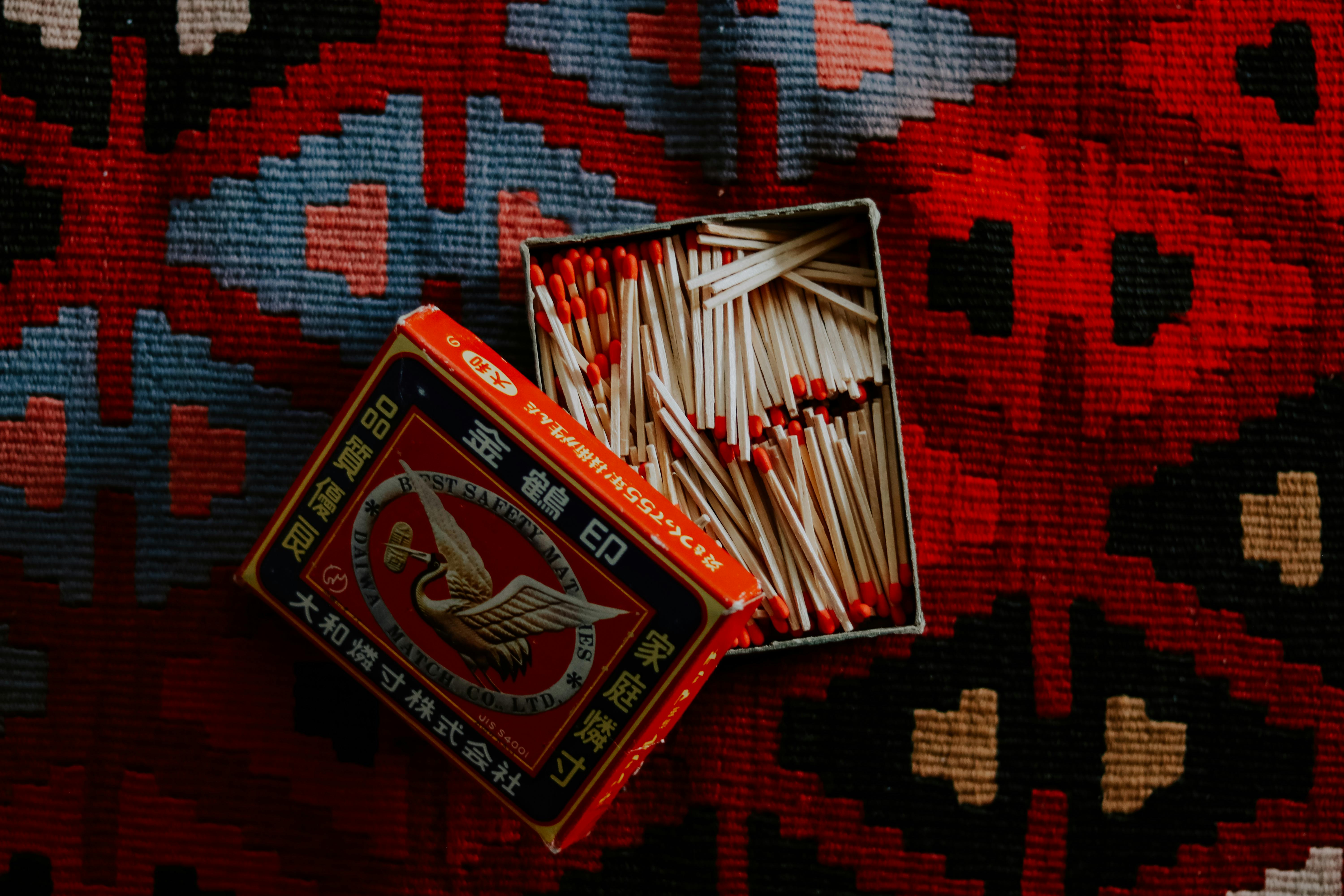 Vintage Matchbox on Traditional Azerbaijani Textile · Free Stock Photo