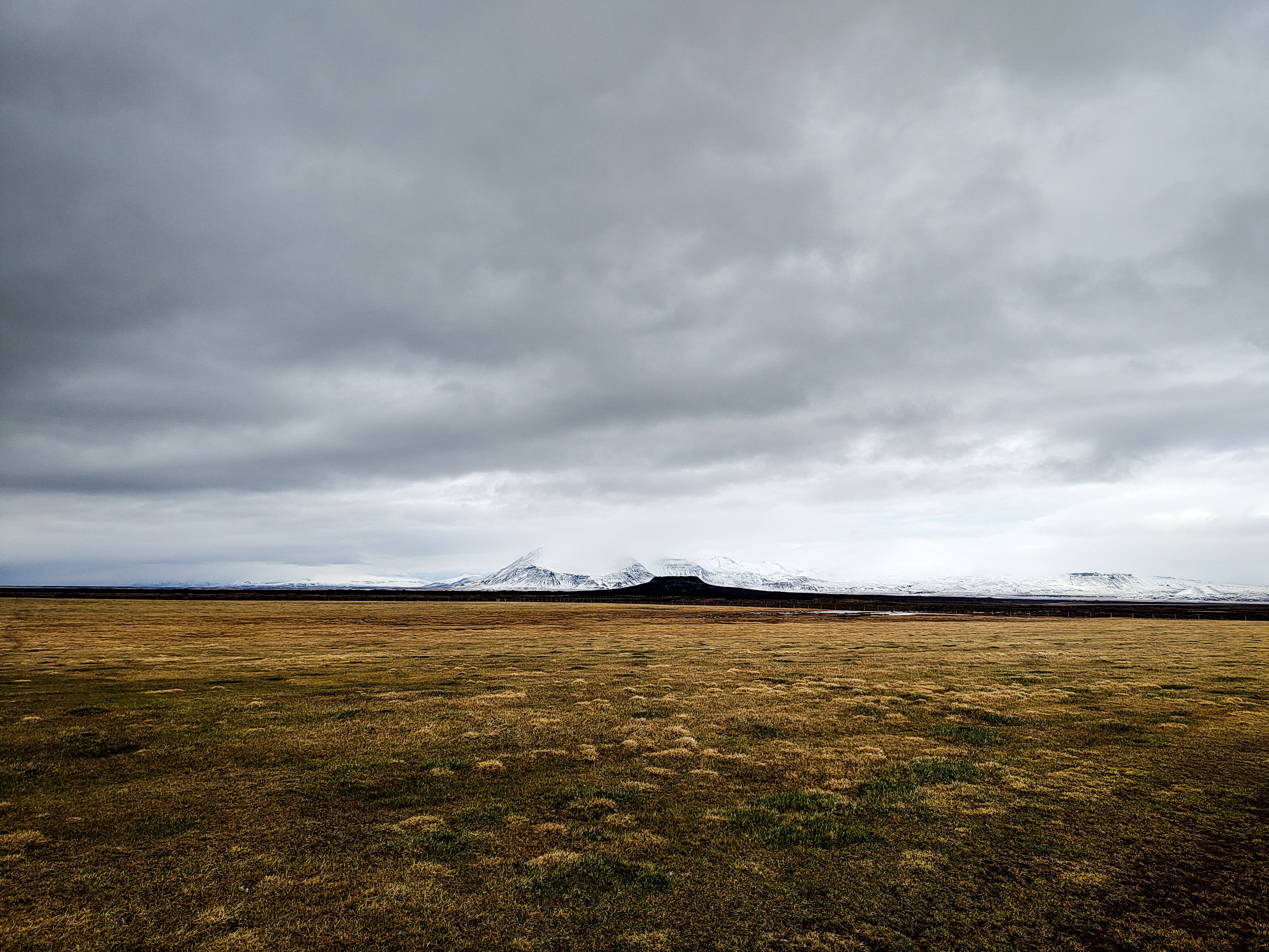 Dramatic Icelandic Landscape Under Cloudy Skies · Free Stock Photo