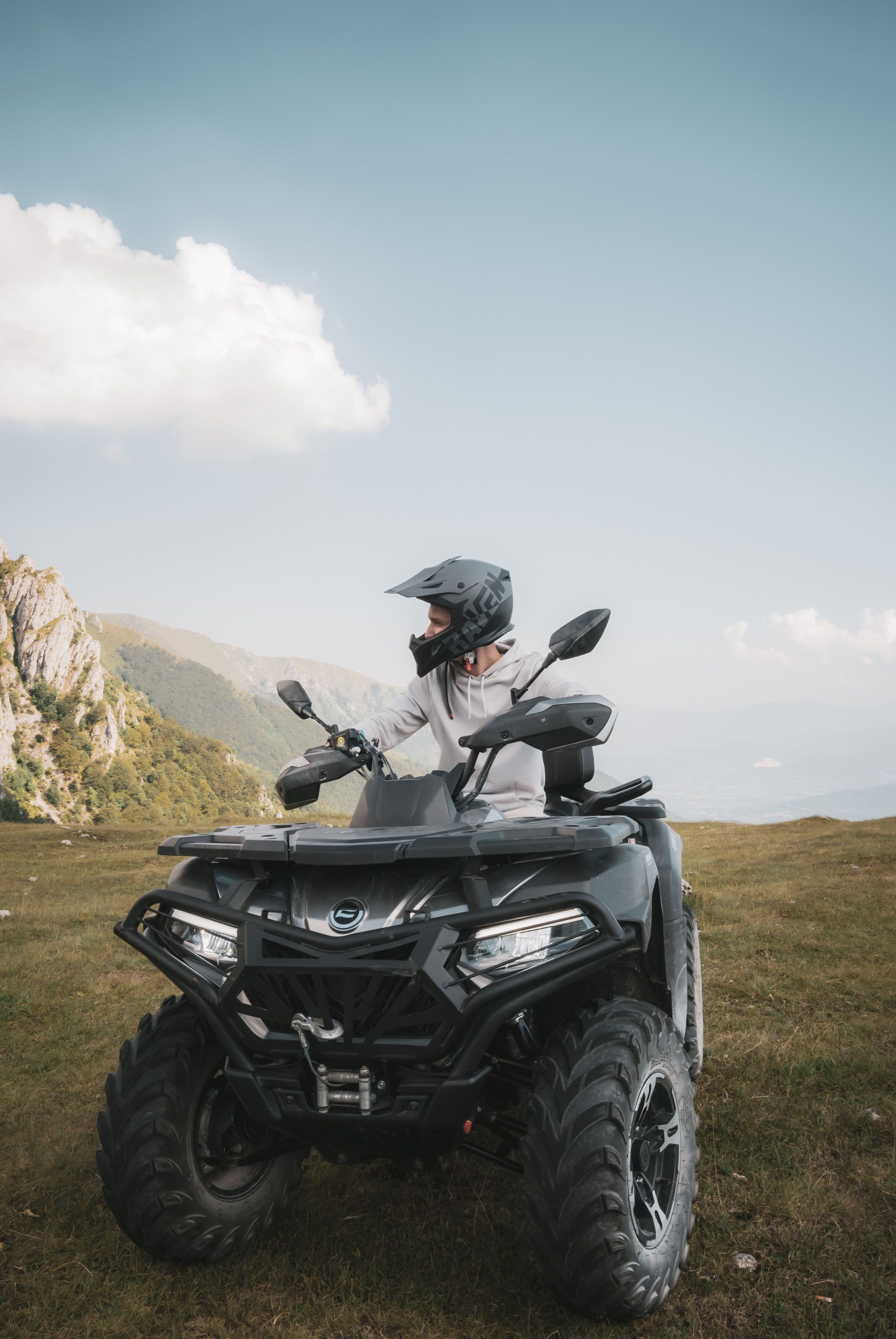 Man Riding ATV in Mountainous Landscape · Free Stock Photo