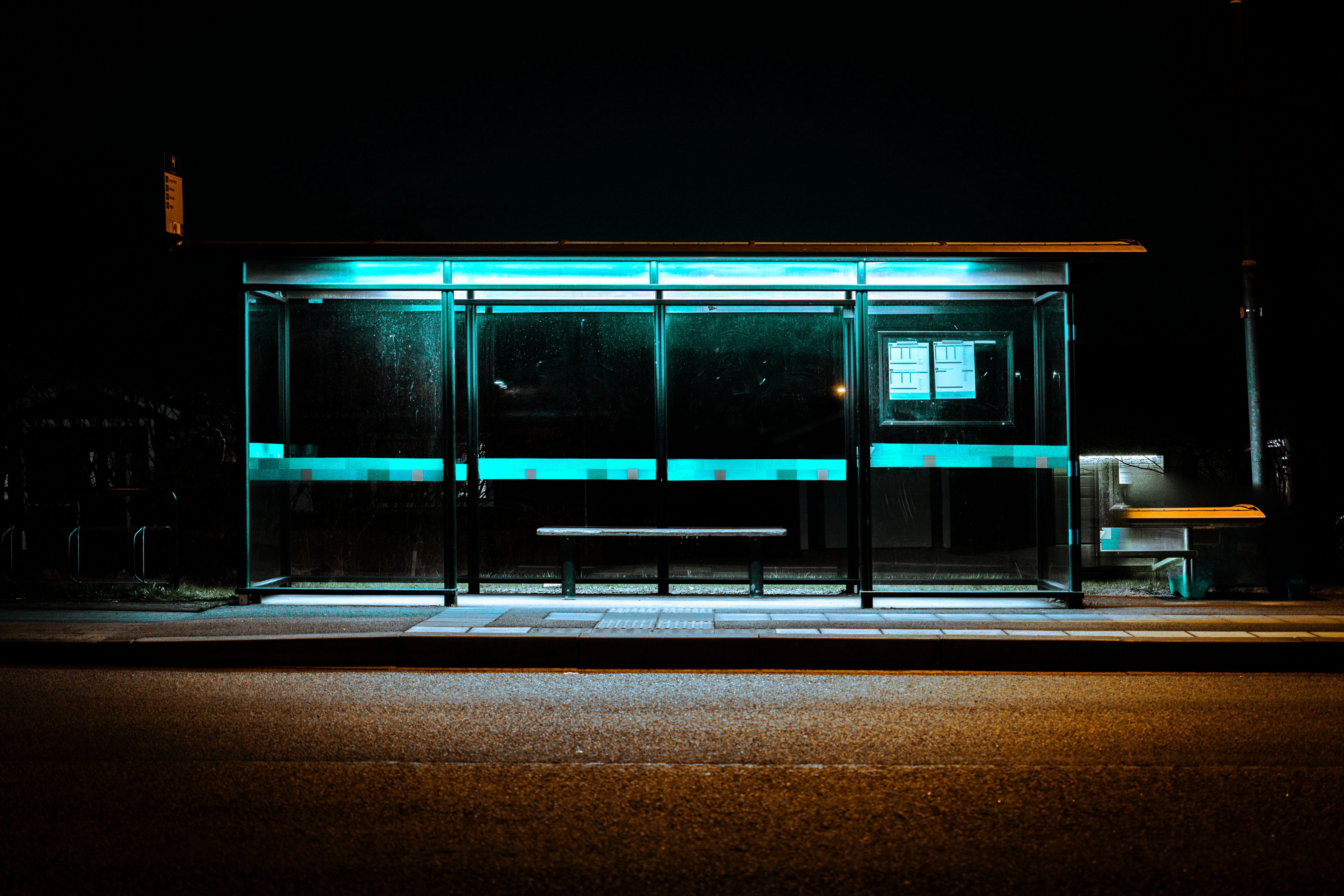 Empty Bus Stop at Night with Neon Lights · Free Stock Photo