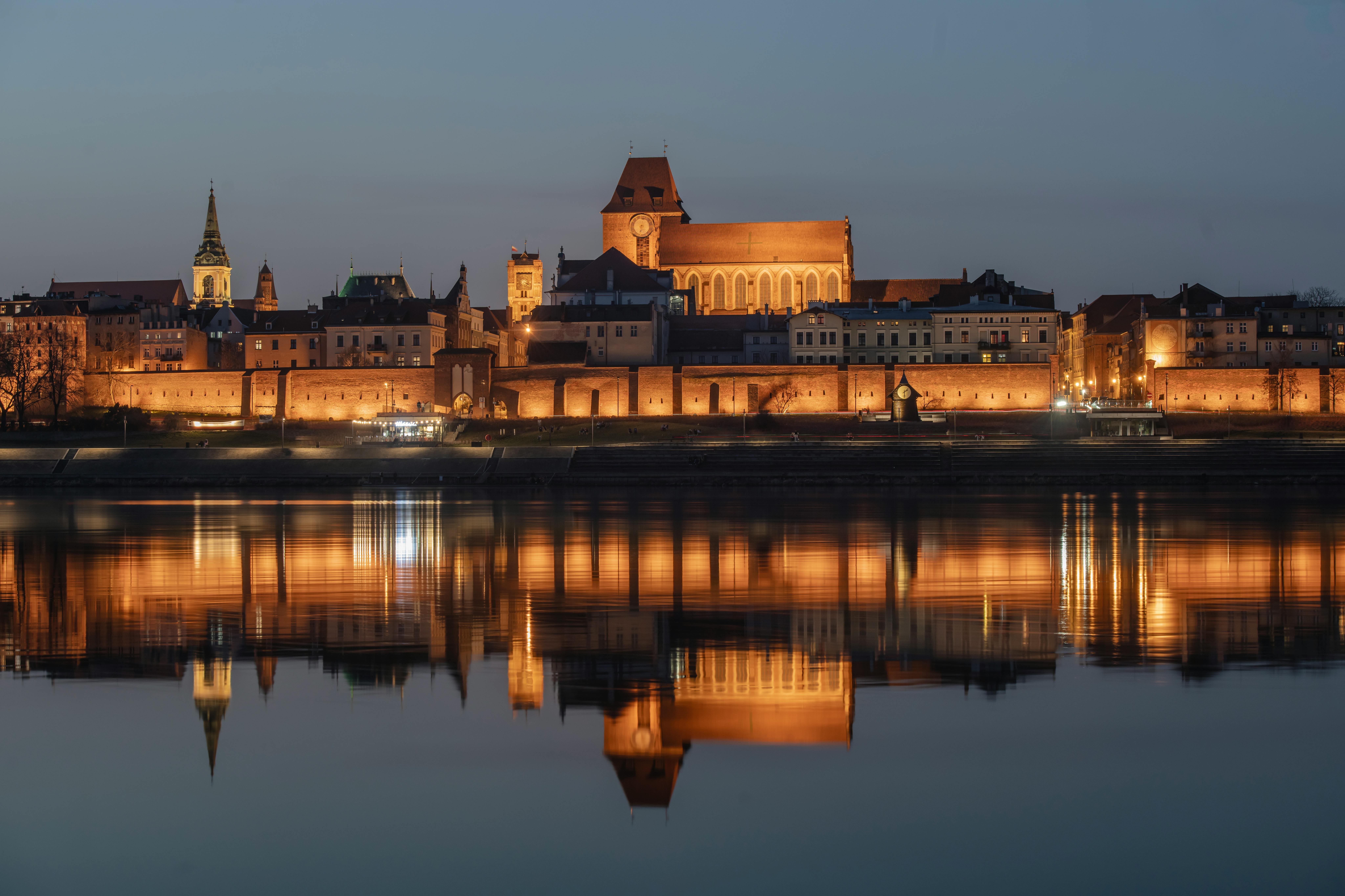 Scenic Night View of Toruń's Historic Skyline · Free Stock Photo