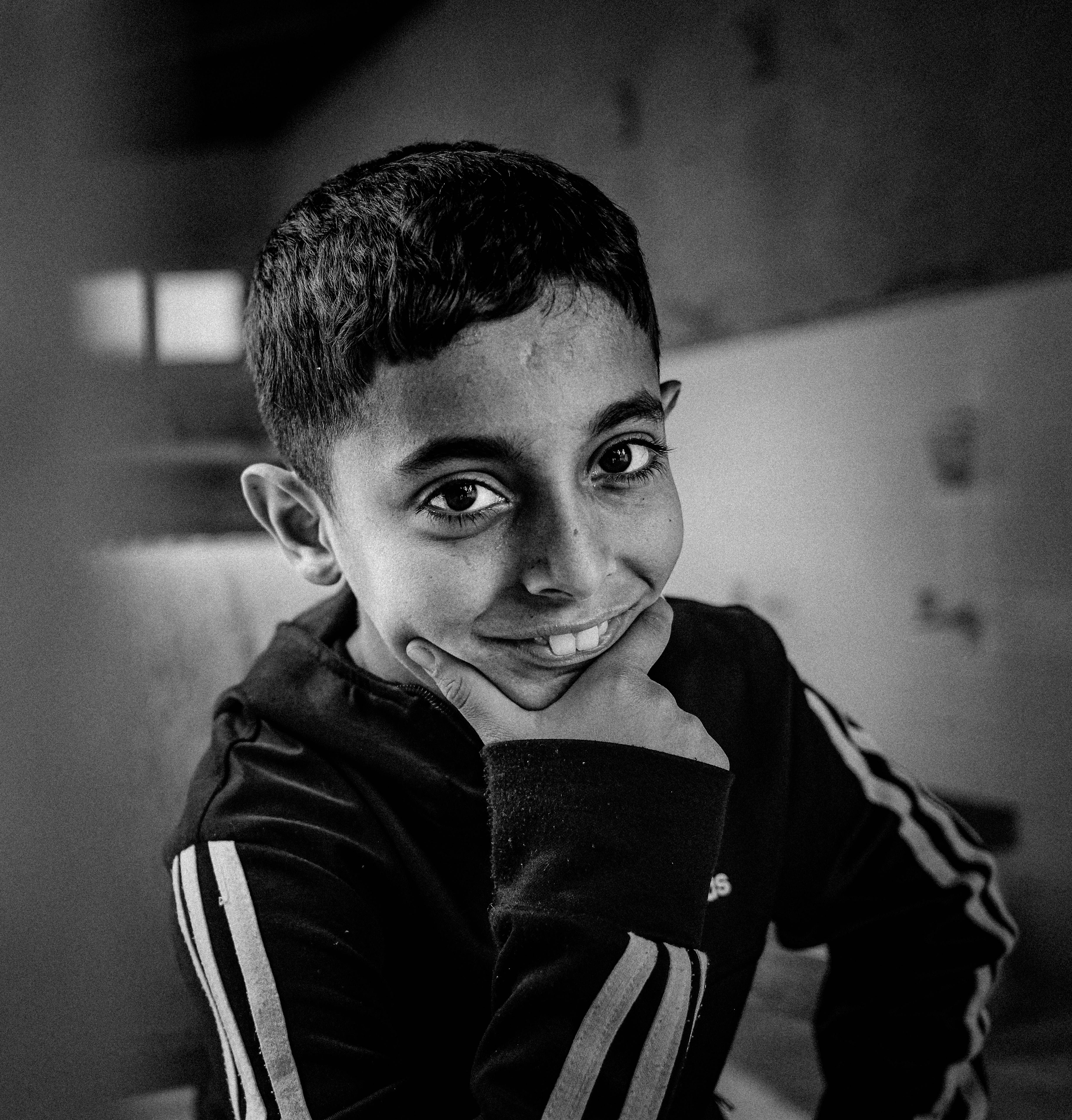 Black and White Portrait of a Smiling Child · Free Stock Photo