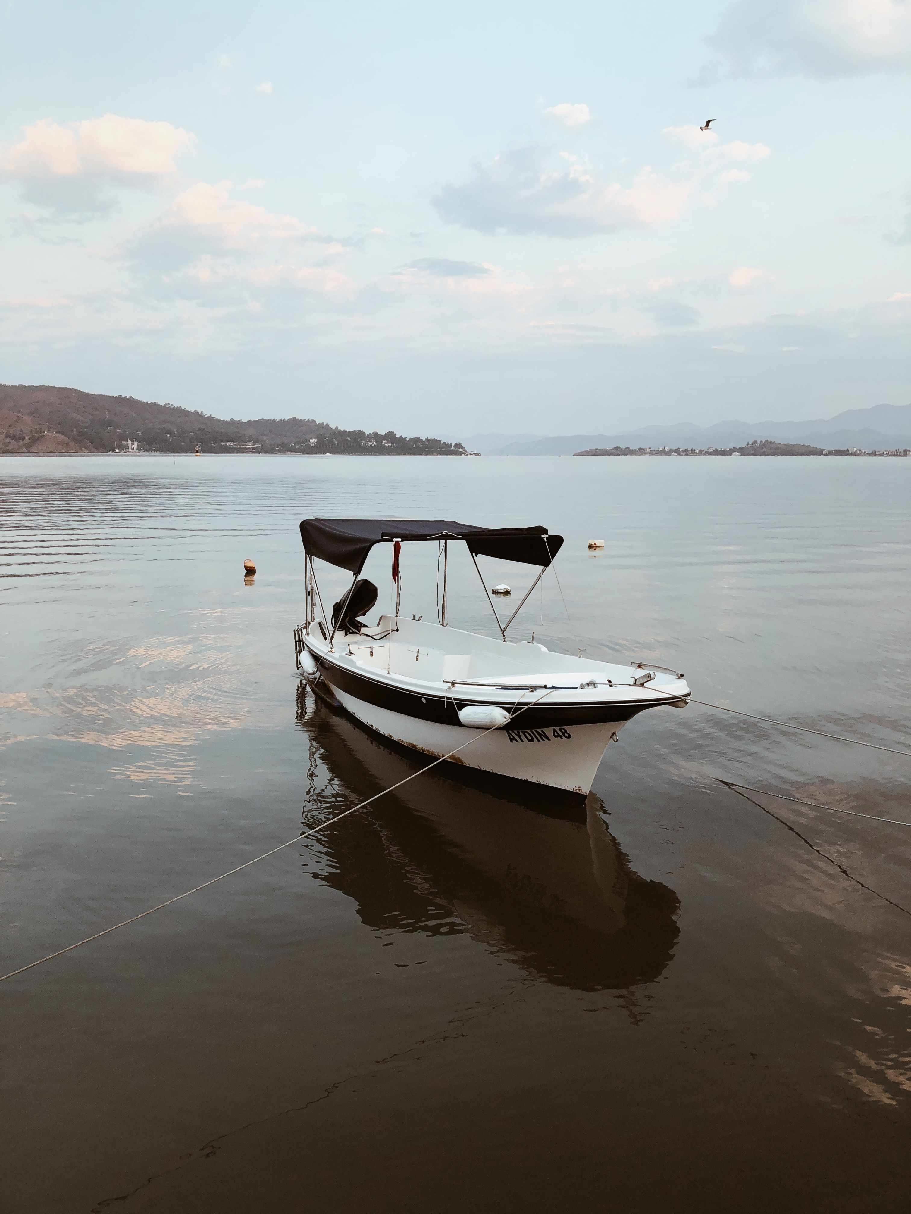 Serene Boat on Calm Water at Sunset · Free Stock Photo