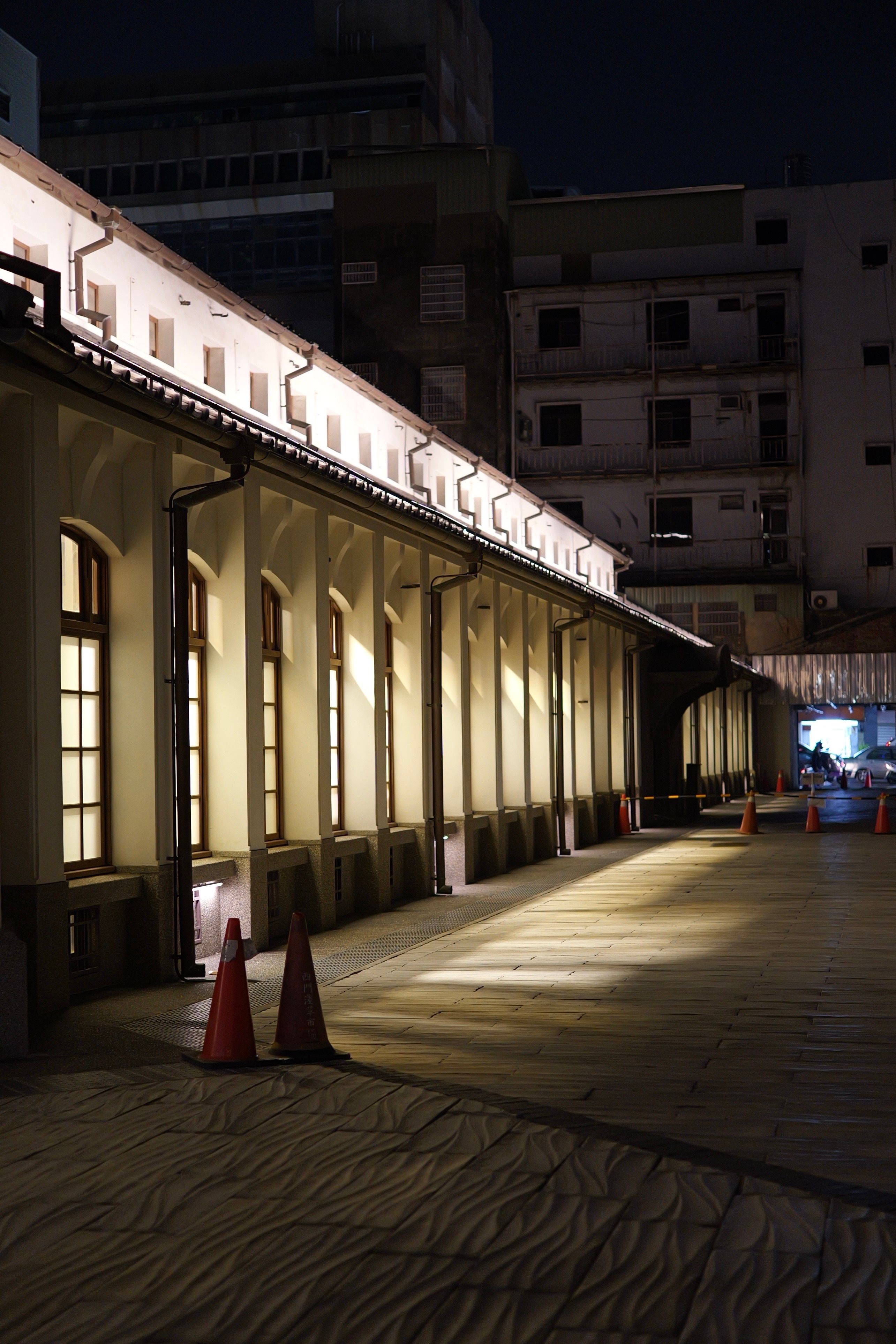 Illuminated Historic Building Corridor at Night · Free Stock Photo