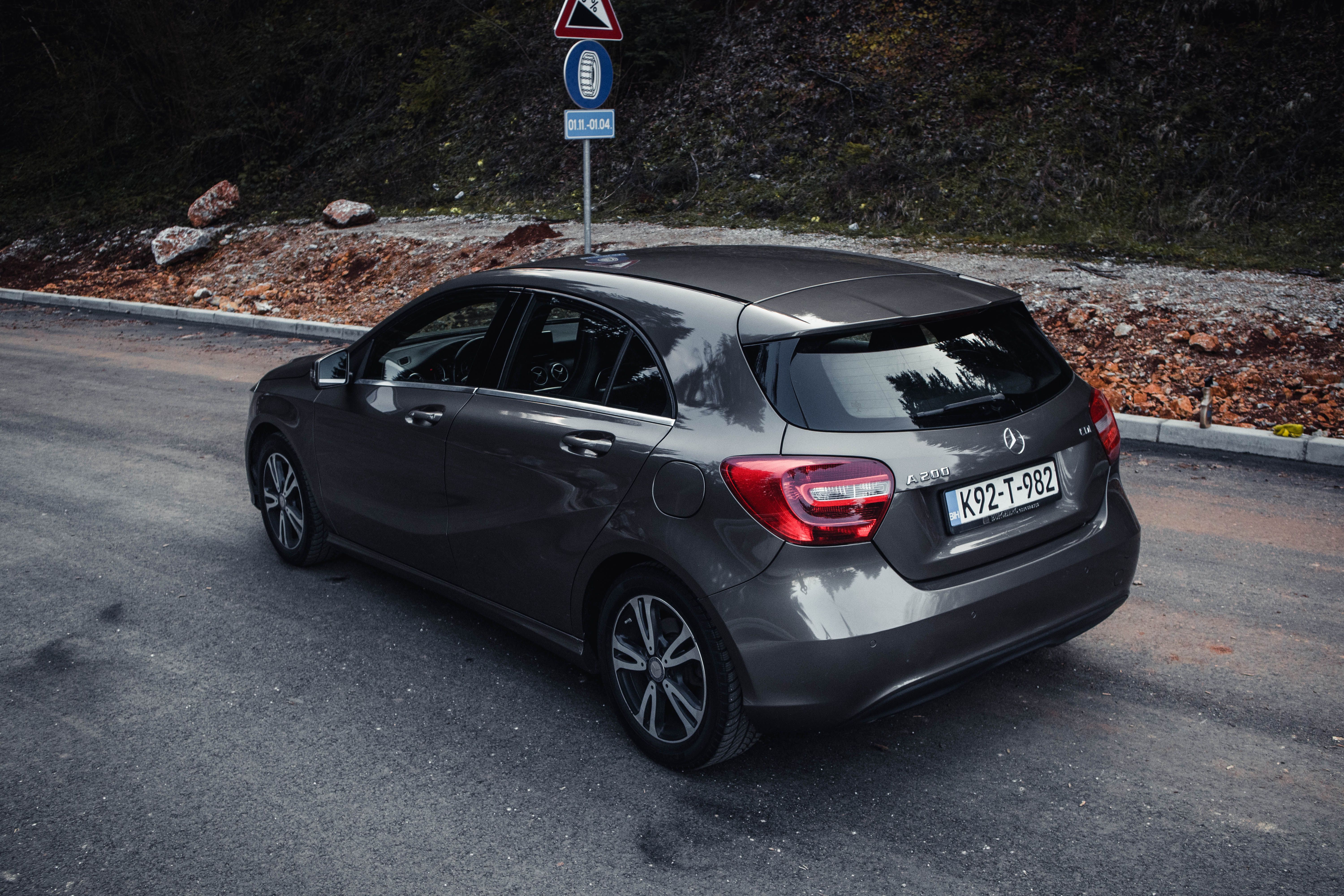 Cinematic View of a Car on a Road in Ilidža · Free Stock Photo