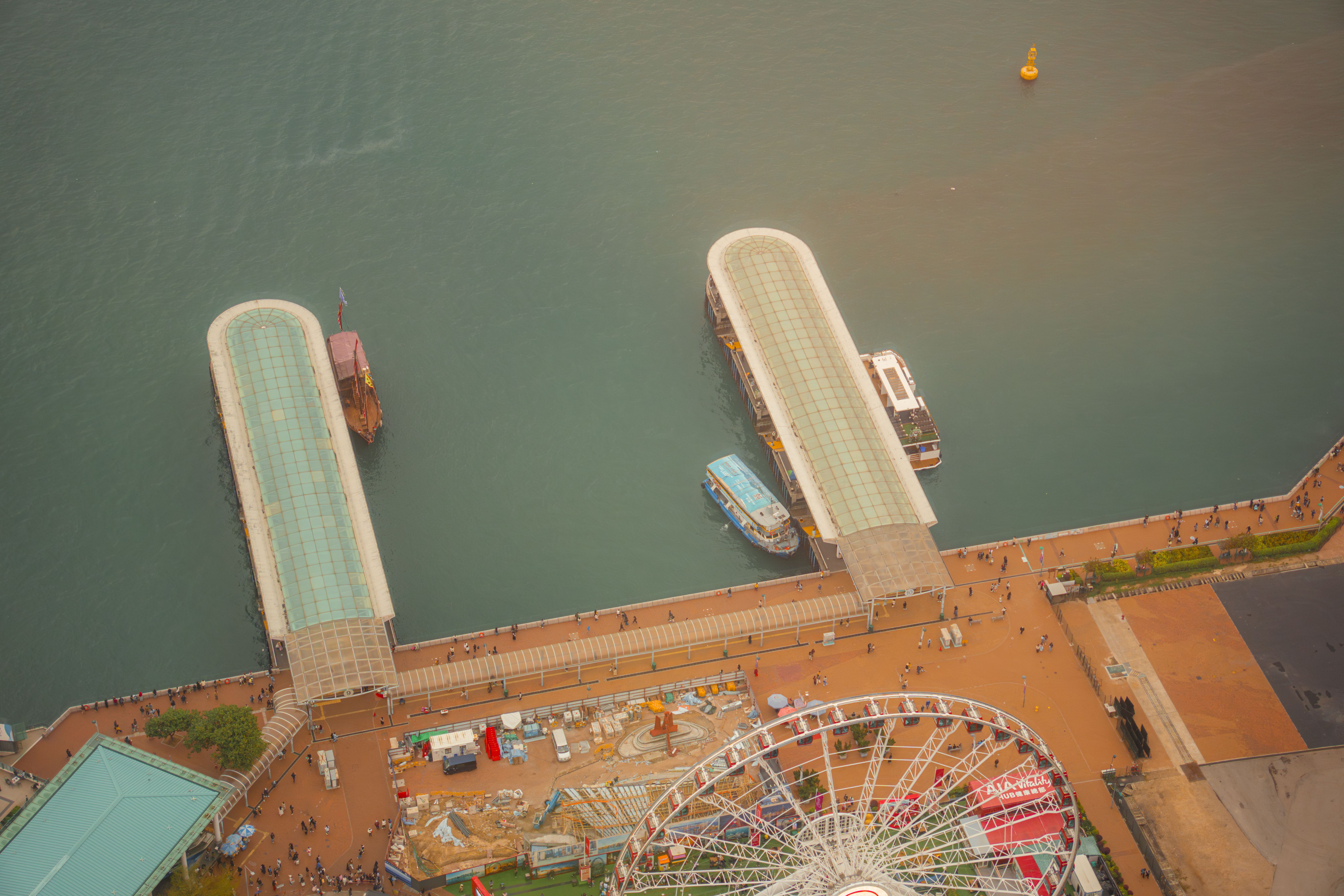 Aerial View of Waterfront Docks and Ferris Wheel · Free Stock Photo
