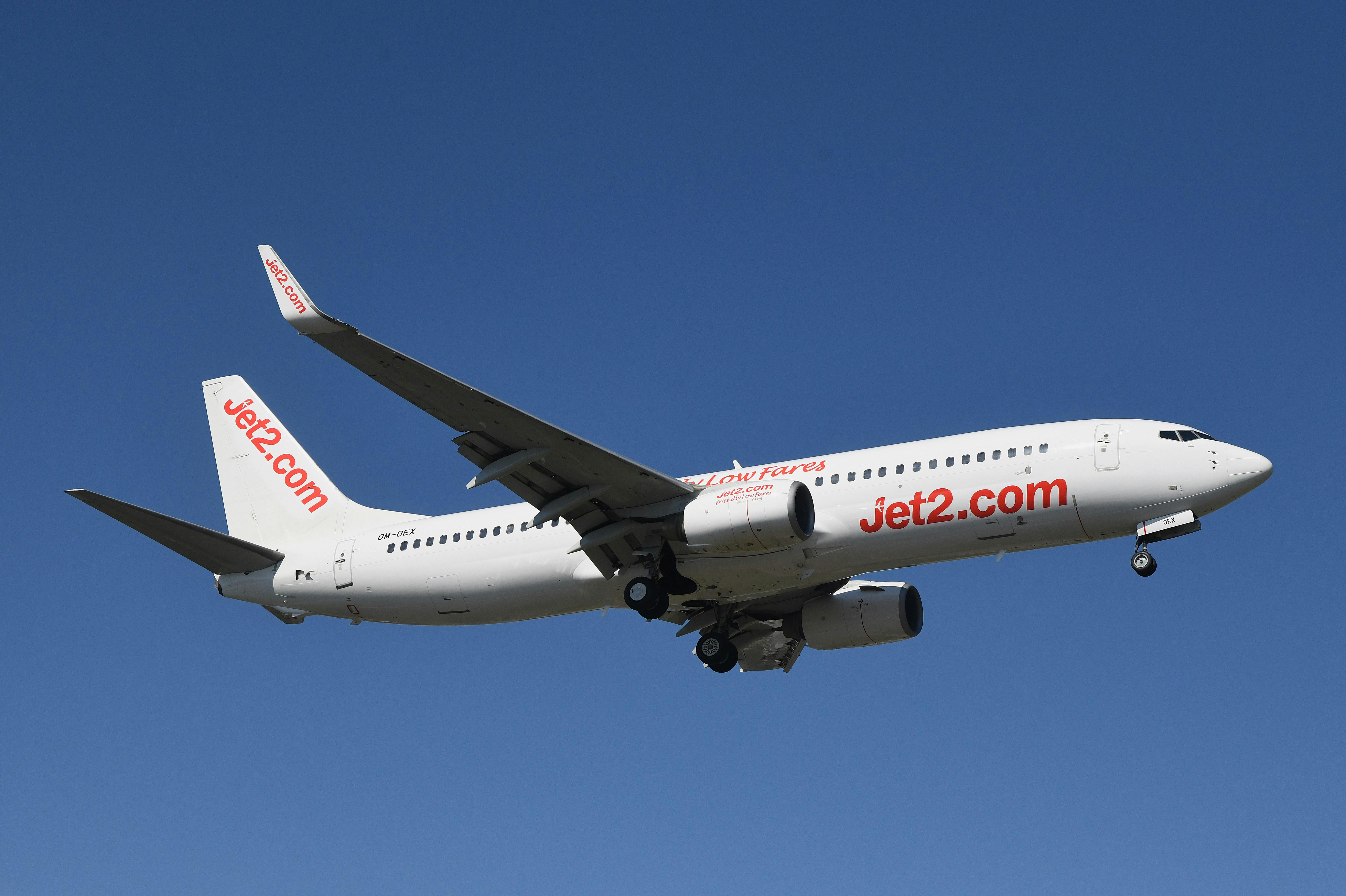 Jet2 Airplane in Flight Over Geneva Skies · Free Stock Photo