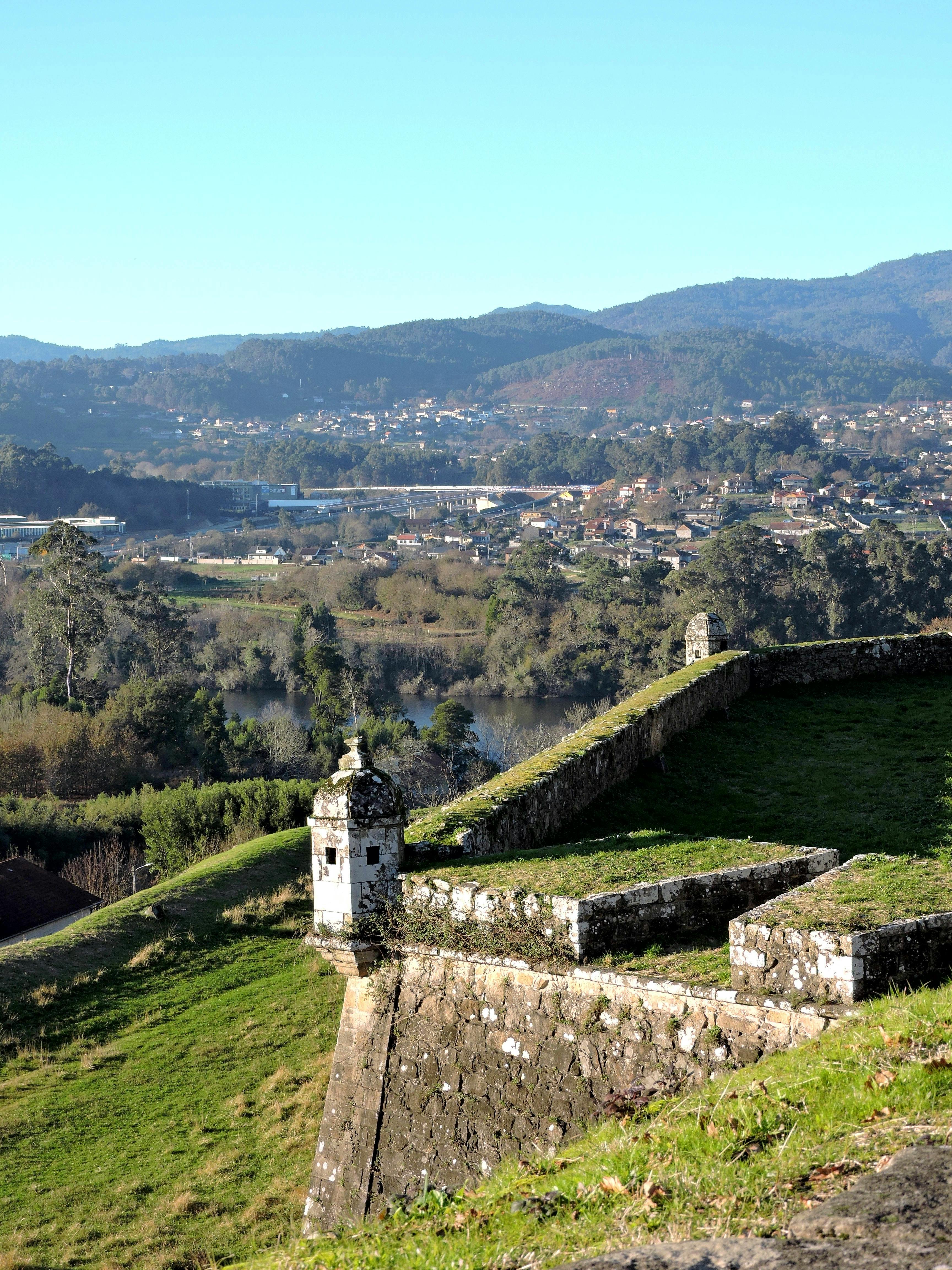 Aerial View of Ancient Stone Fort in Scenic Landscape · Free Stock Photo