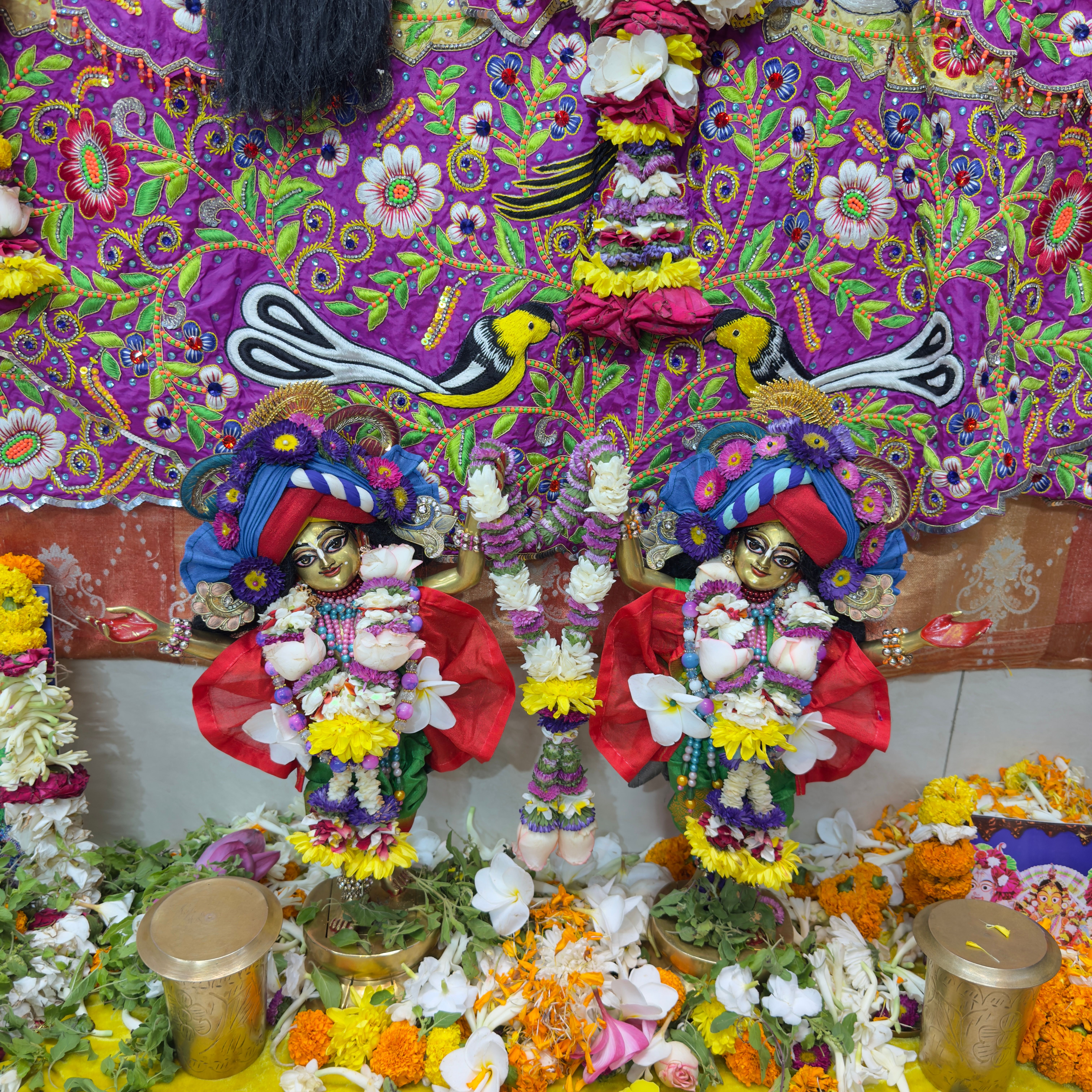Vibrant Indian Religious Dolls with Floral Decorations · Free Stock Photo
