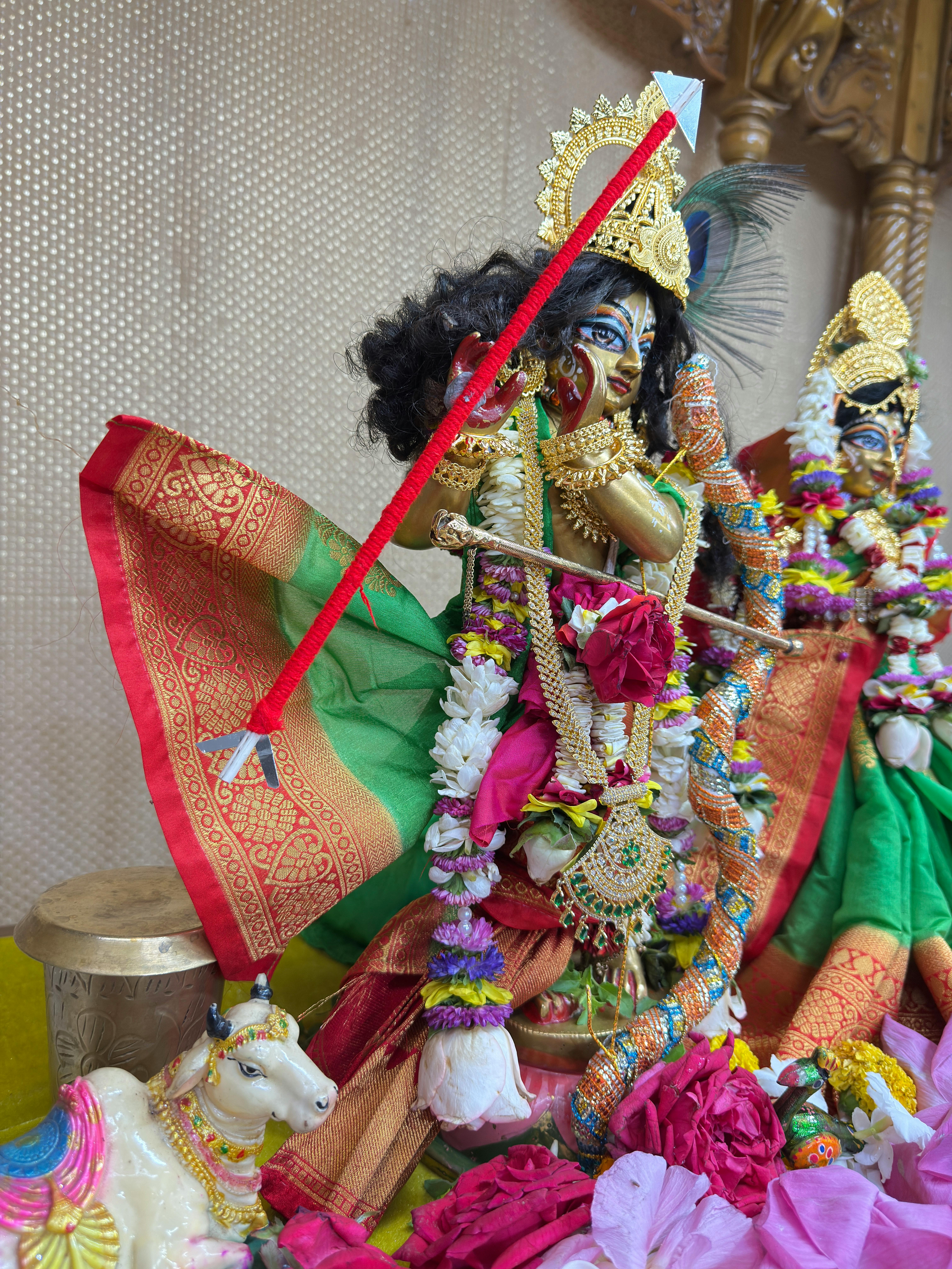 Vibrant Hindu Deity Statues with Floral Garlands · Free Stock Photo