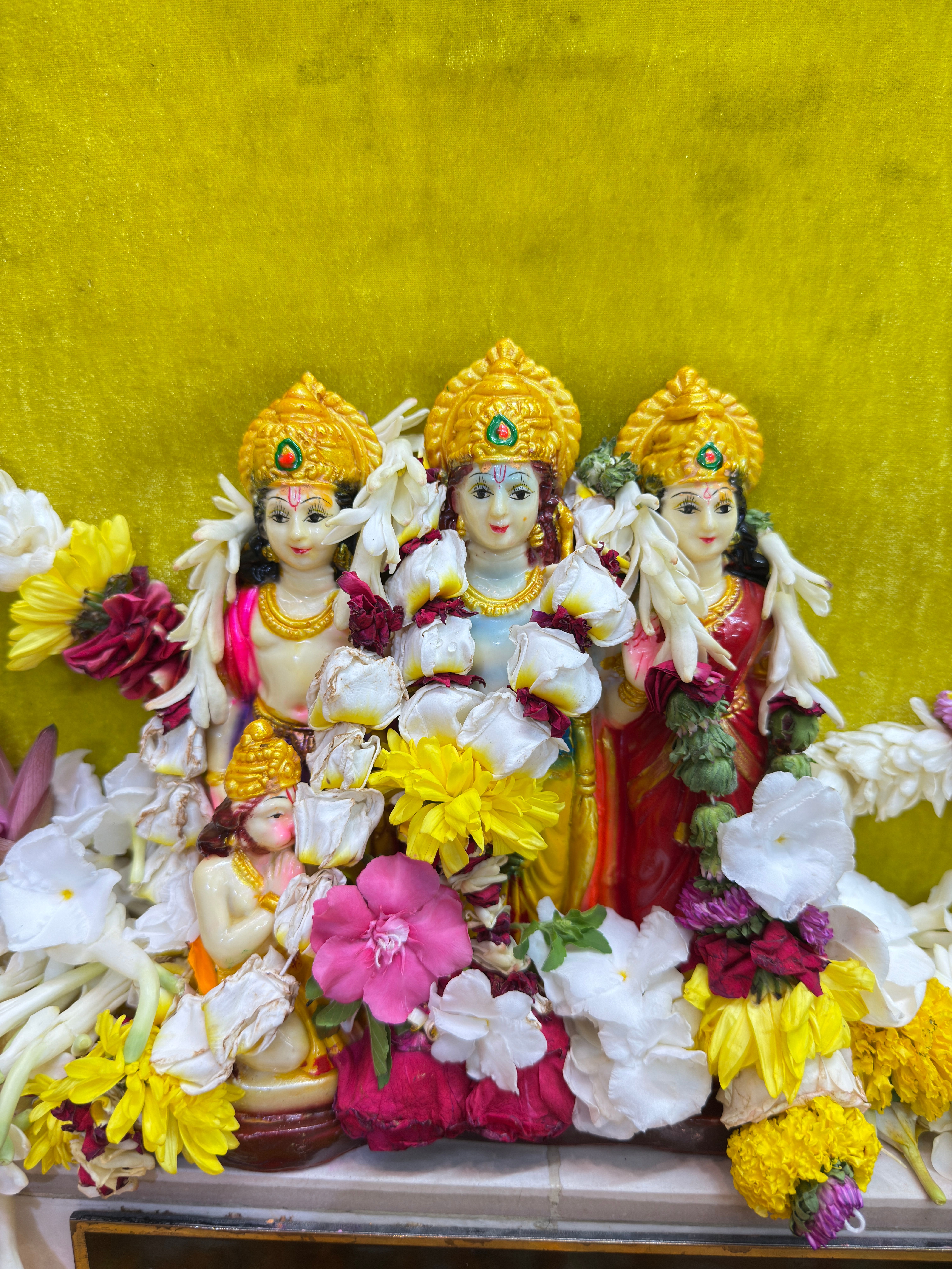 Colorful Hindu Deities with Vibrant Flowers · Free Stock Photo