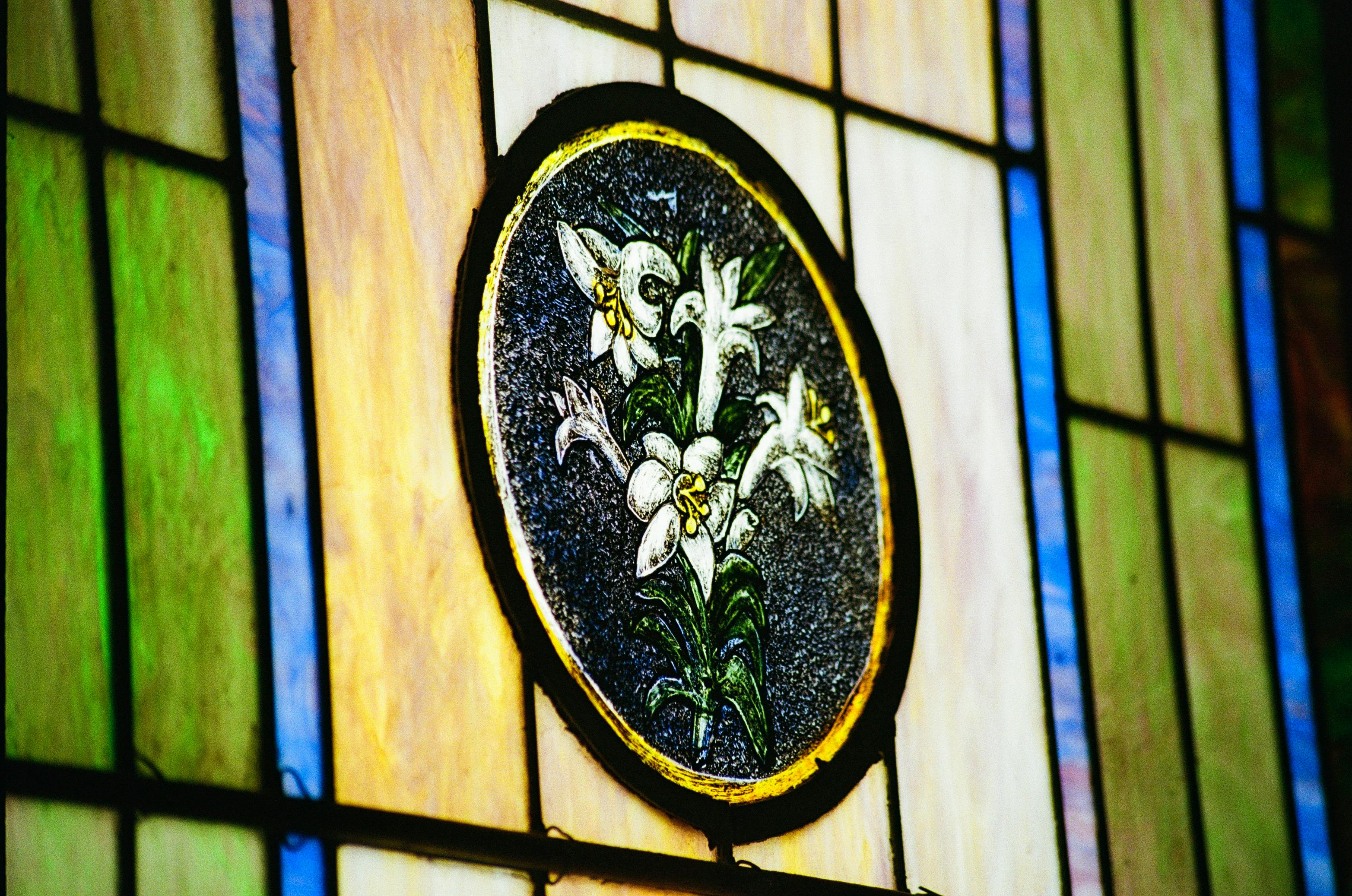 Stained Glass Window with Easter Lily Design · Free Stock Photo