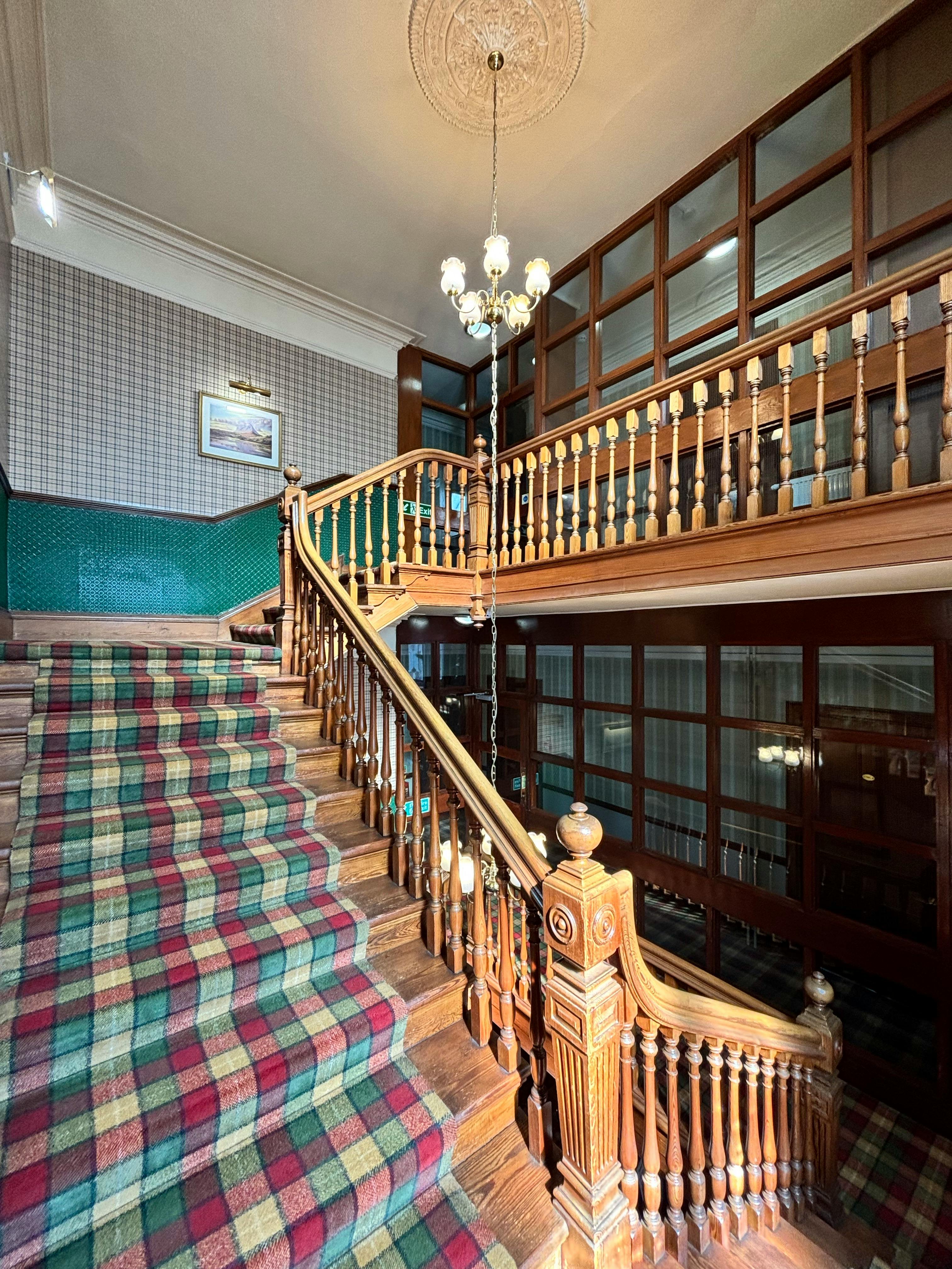 Bend of Decorated Staircase Railing · Free Stock Photo