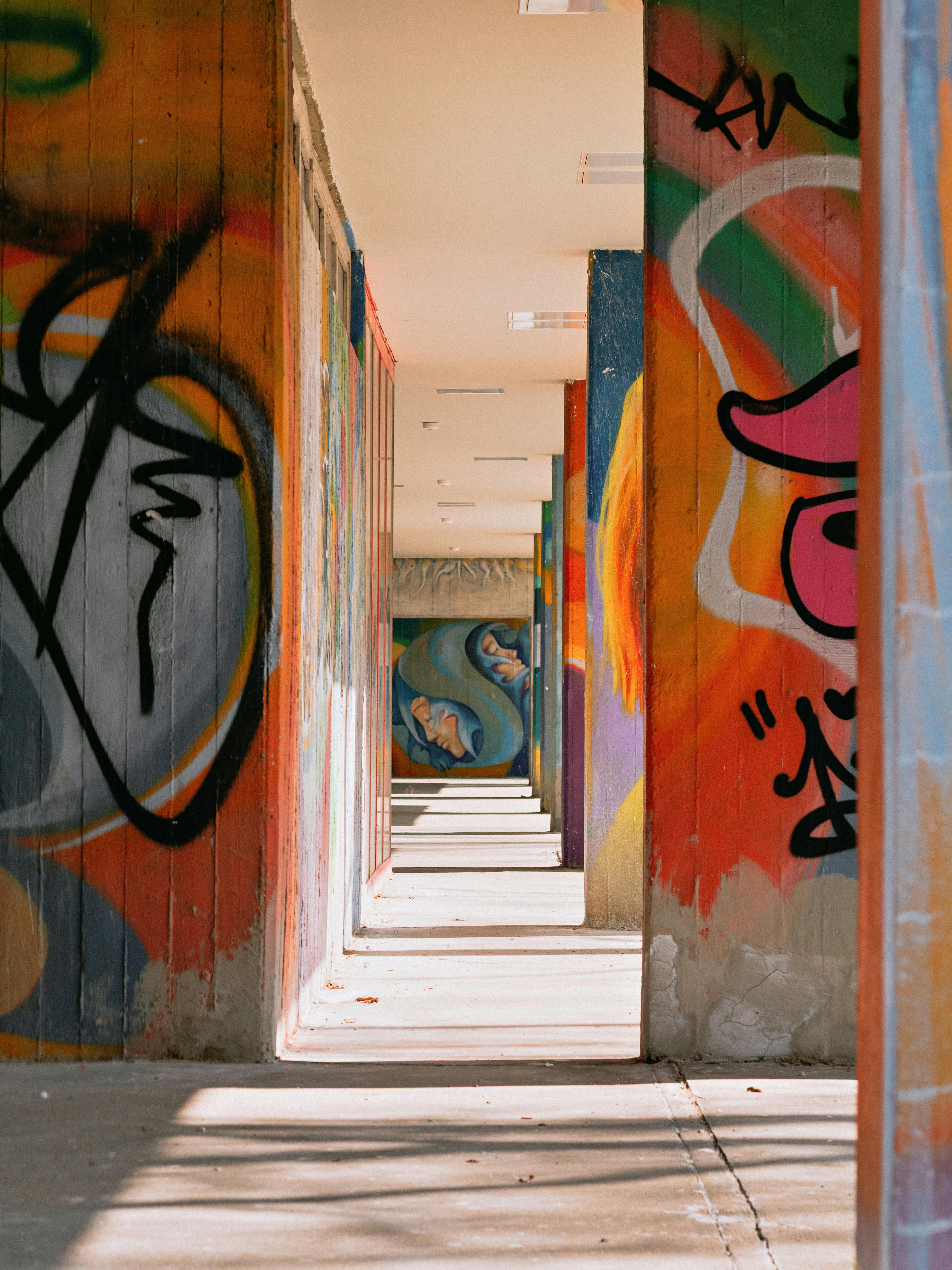 Vibrant Graffiti Art in Berlin Urban Corridor · Free Stock Photo