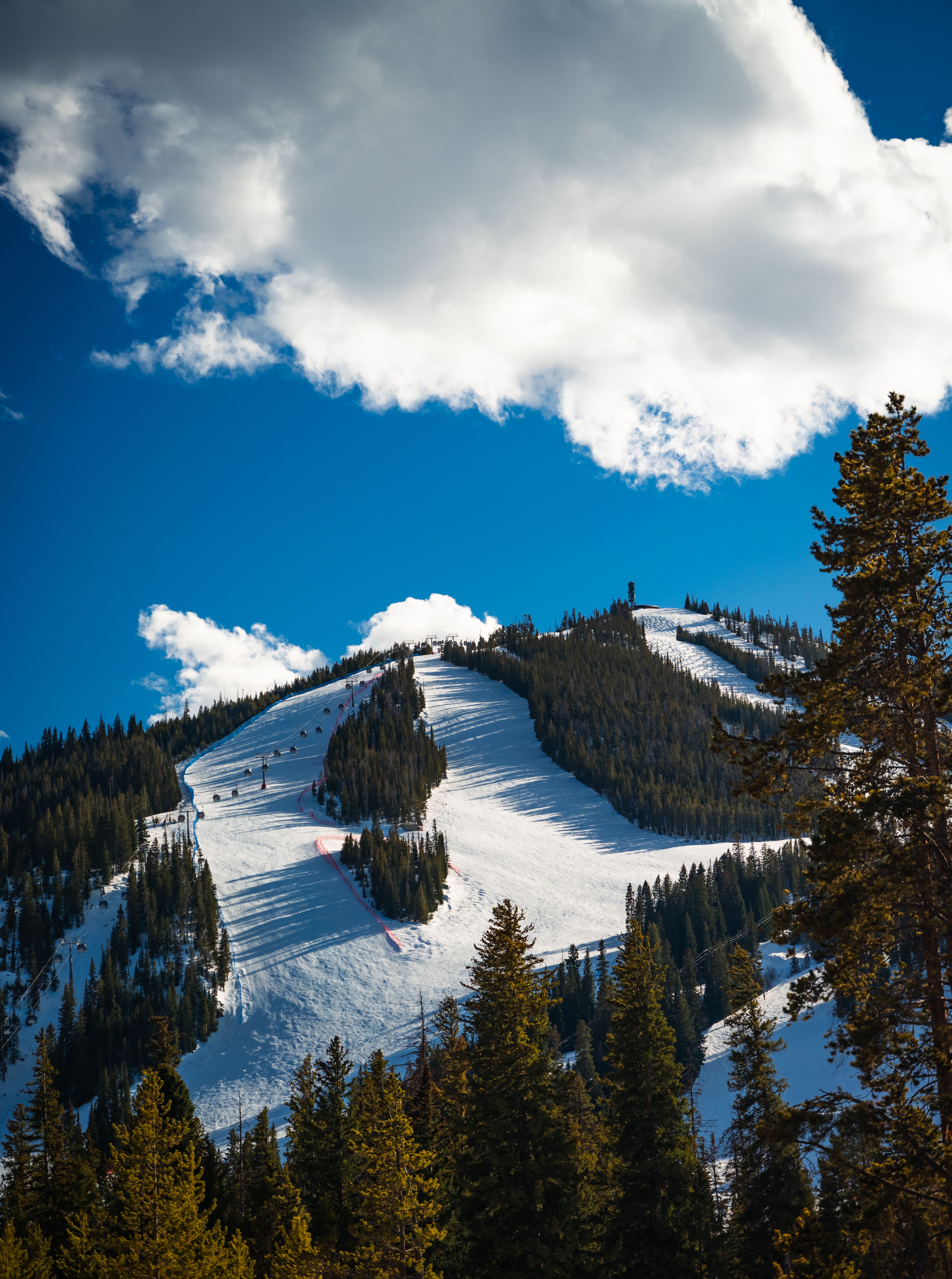 Snowy Mountain Ski Slope under Blue Sky · Free Stock Photo