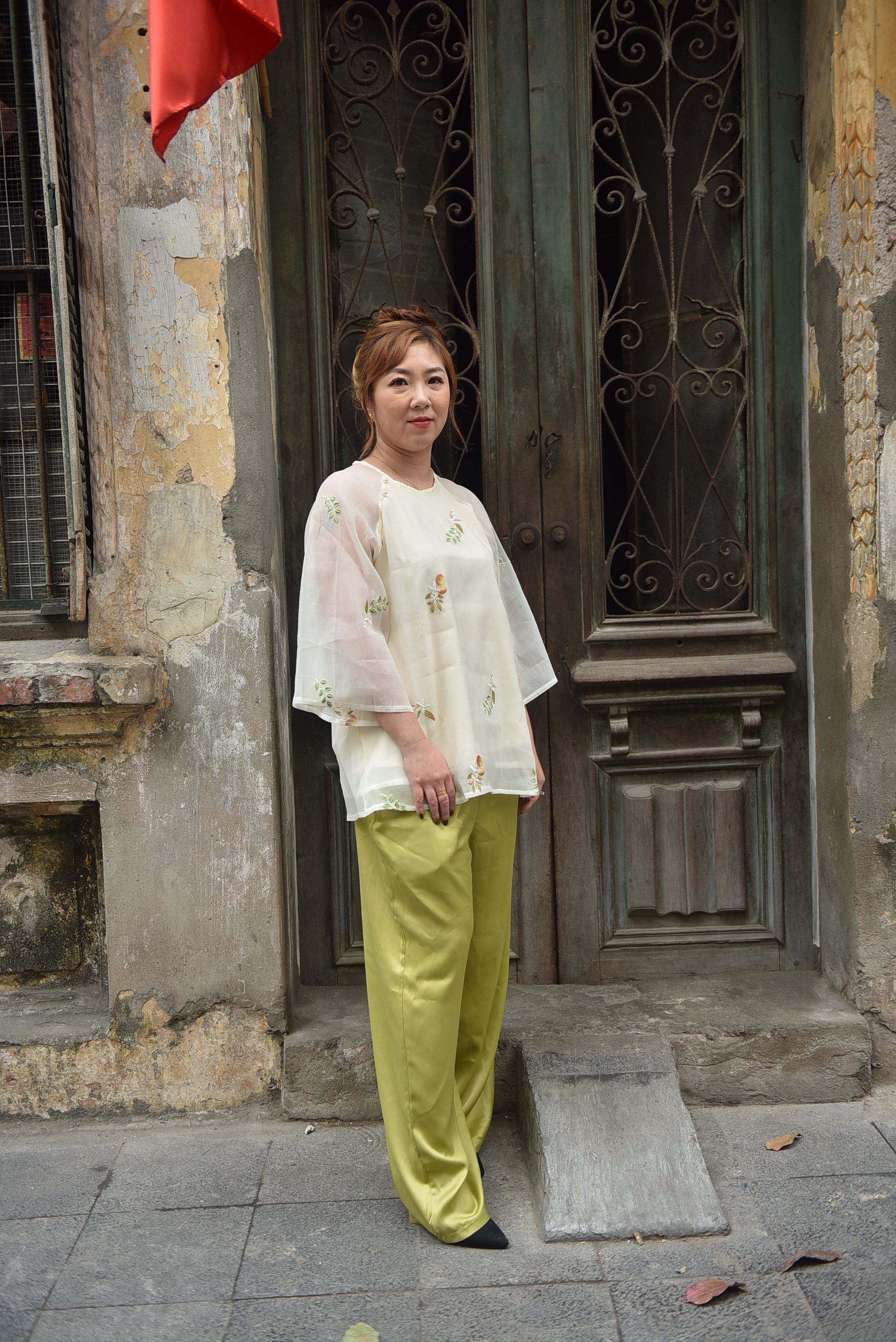 Stylish Woman Posing on Rustic Street · Free Stock Photo