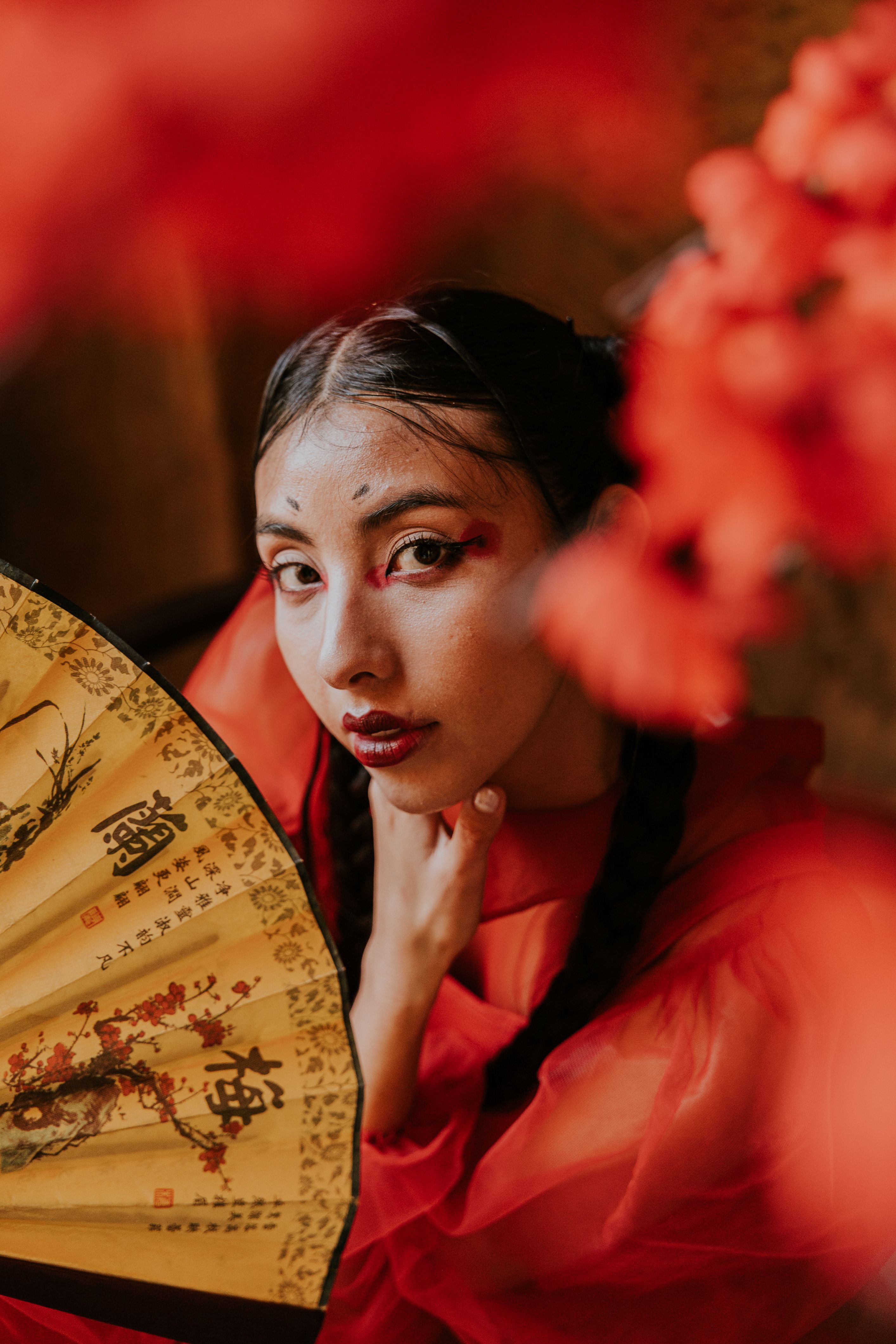 Artistic Portrait of Woman with Traditional Fan · Free Stock Photo