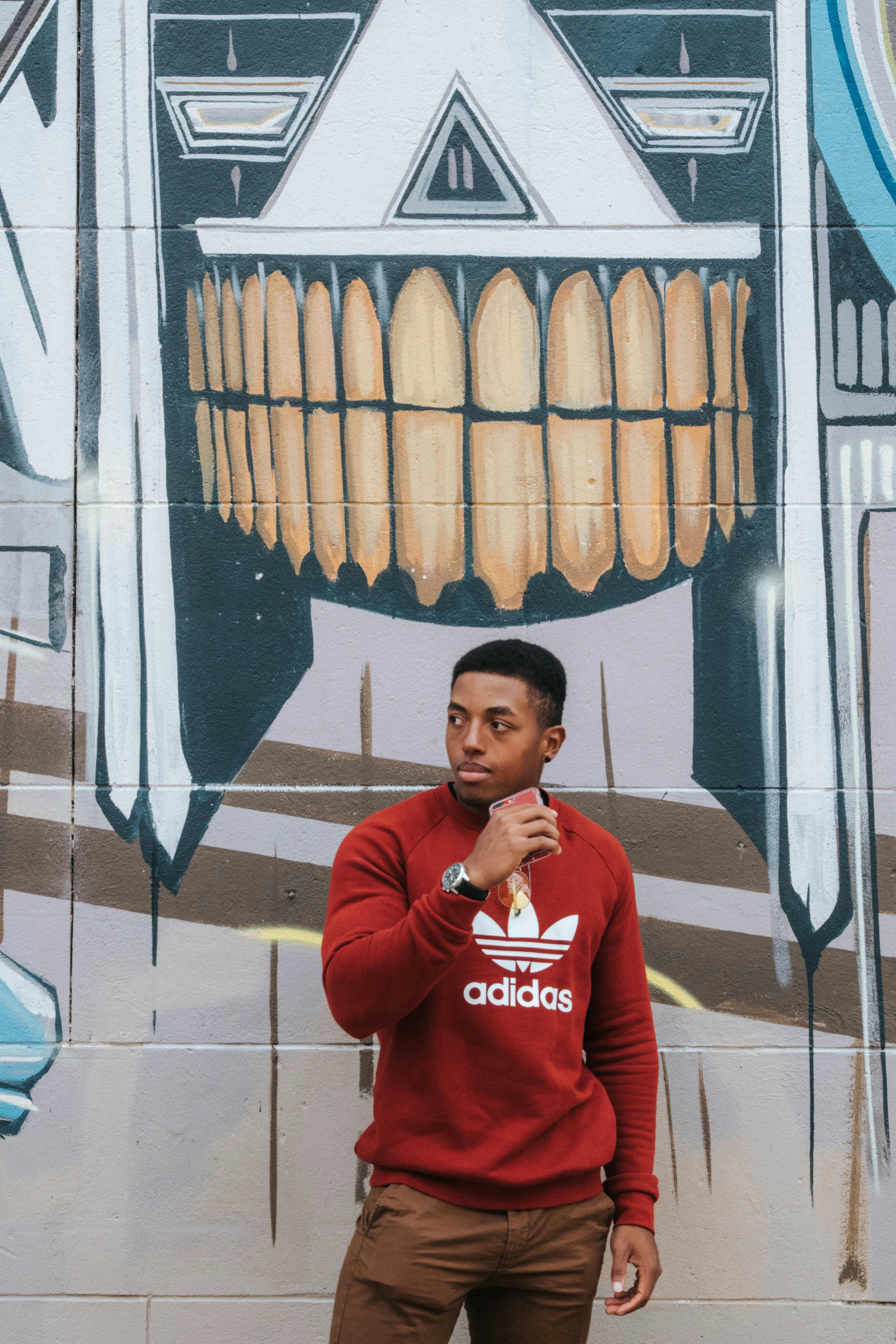 Man Standing Against Wall · Free Stock Photo