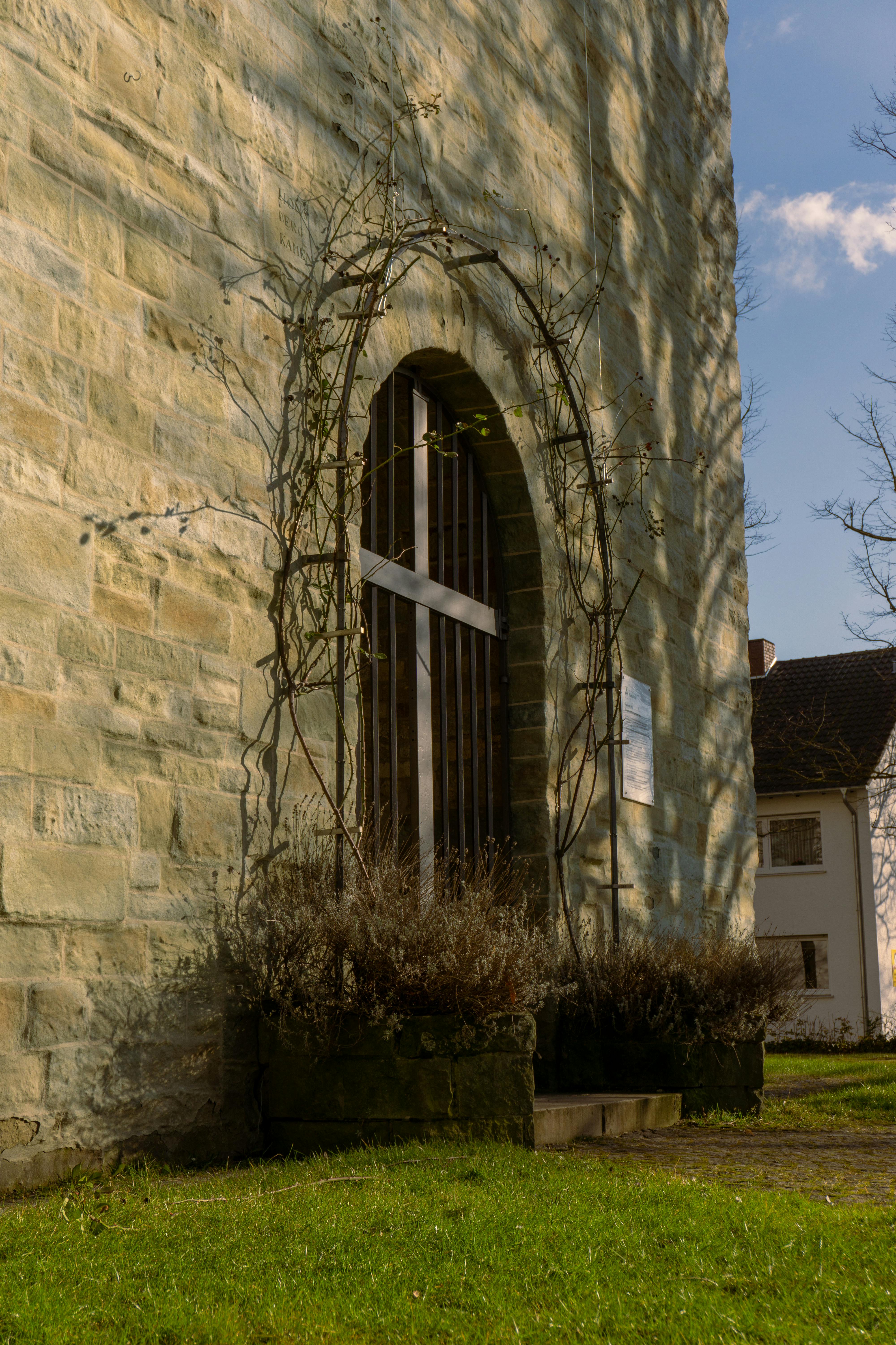 Historic Stone Building with Iron Barred Window · Free Stock Photo
