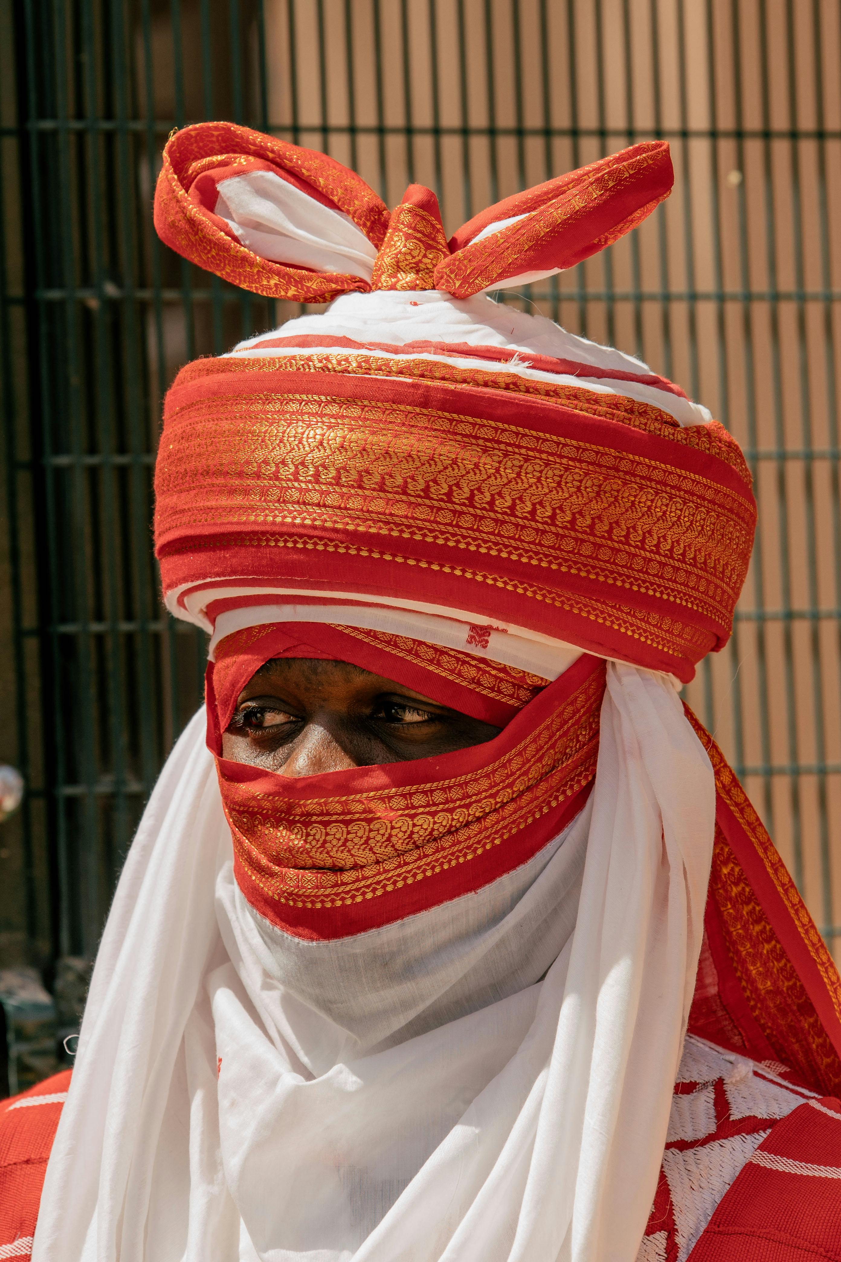 Man in Traditional Red and White Turban Outdoors · Free Stock Photo