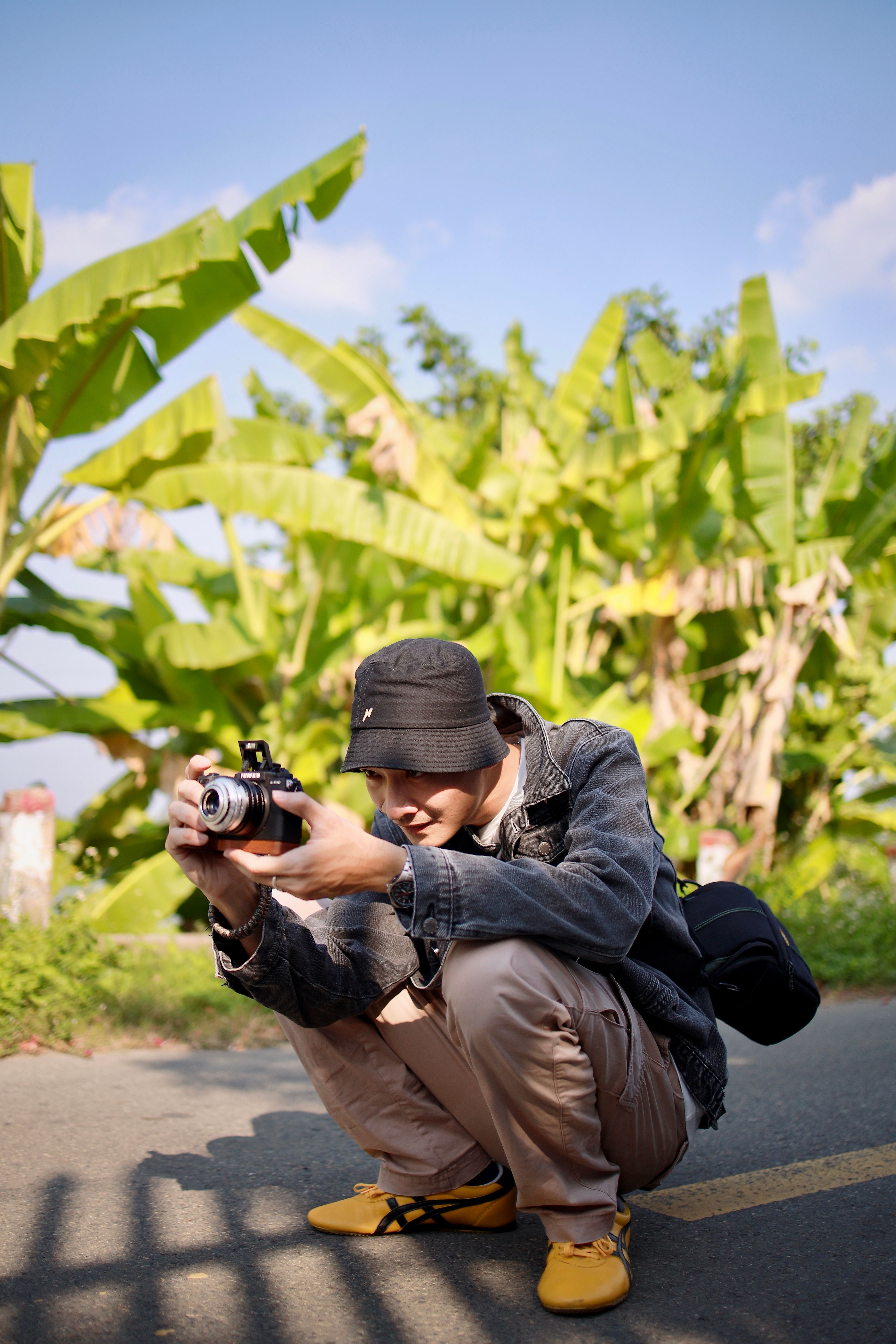 Young Photographer Capturing Nature Outdoors · Free Stock Photo