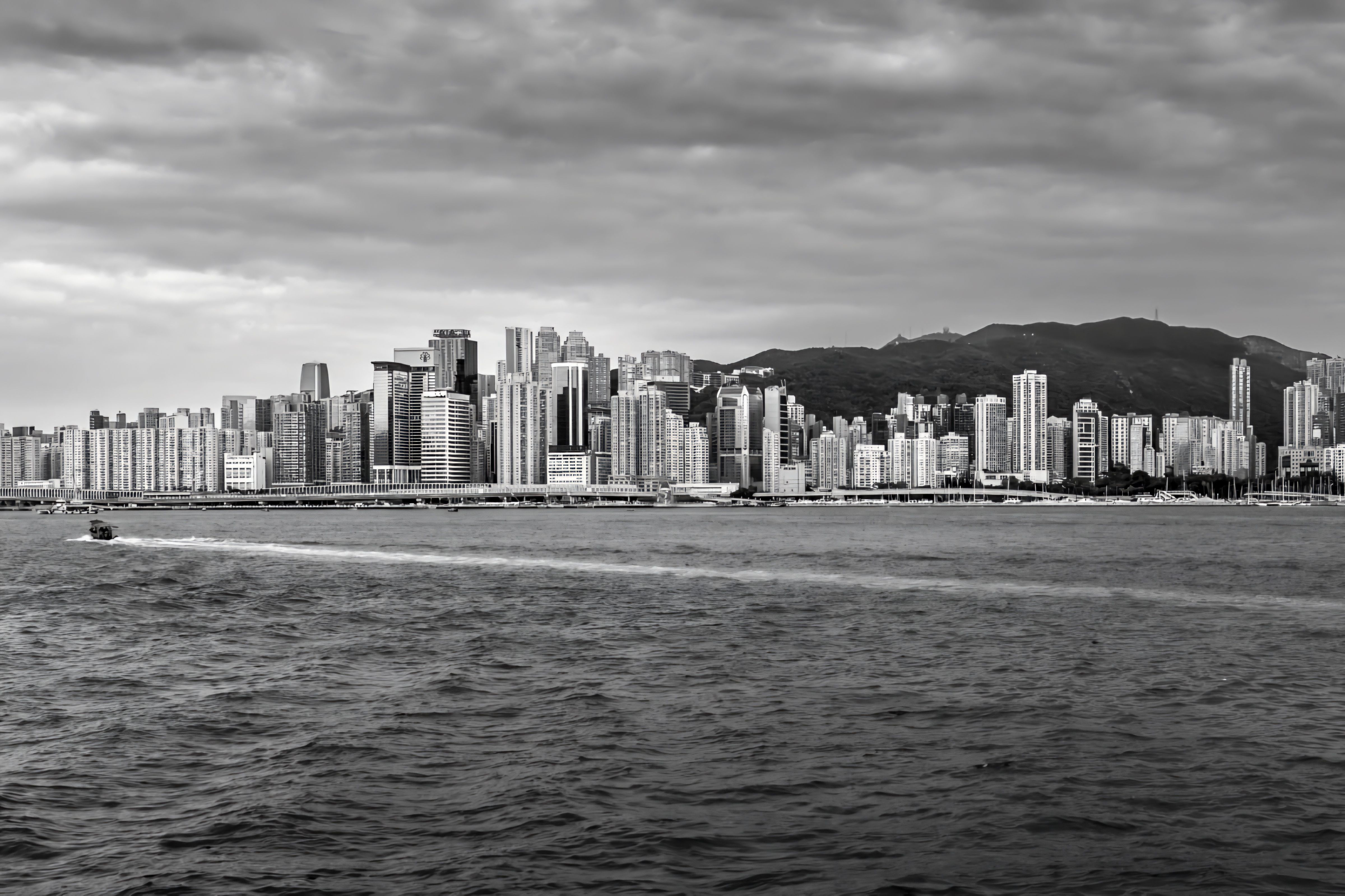 Black and White Hong Kong Skyline Across Harbor · Free Stock Photo