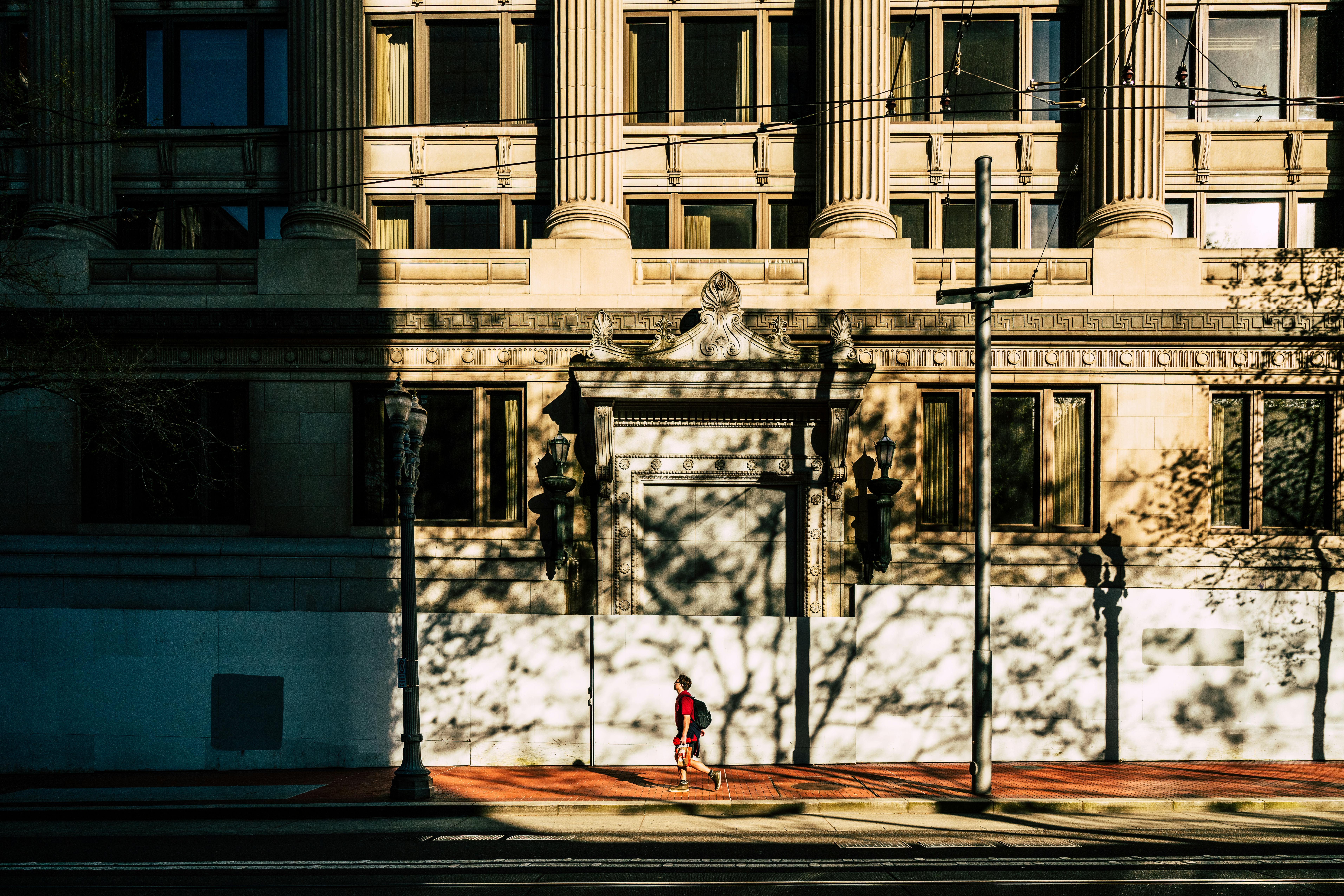 Lone Runner in Downtown Portland Shadows · Free Stock Photo