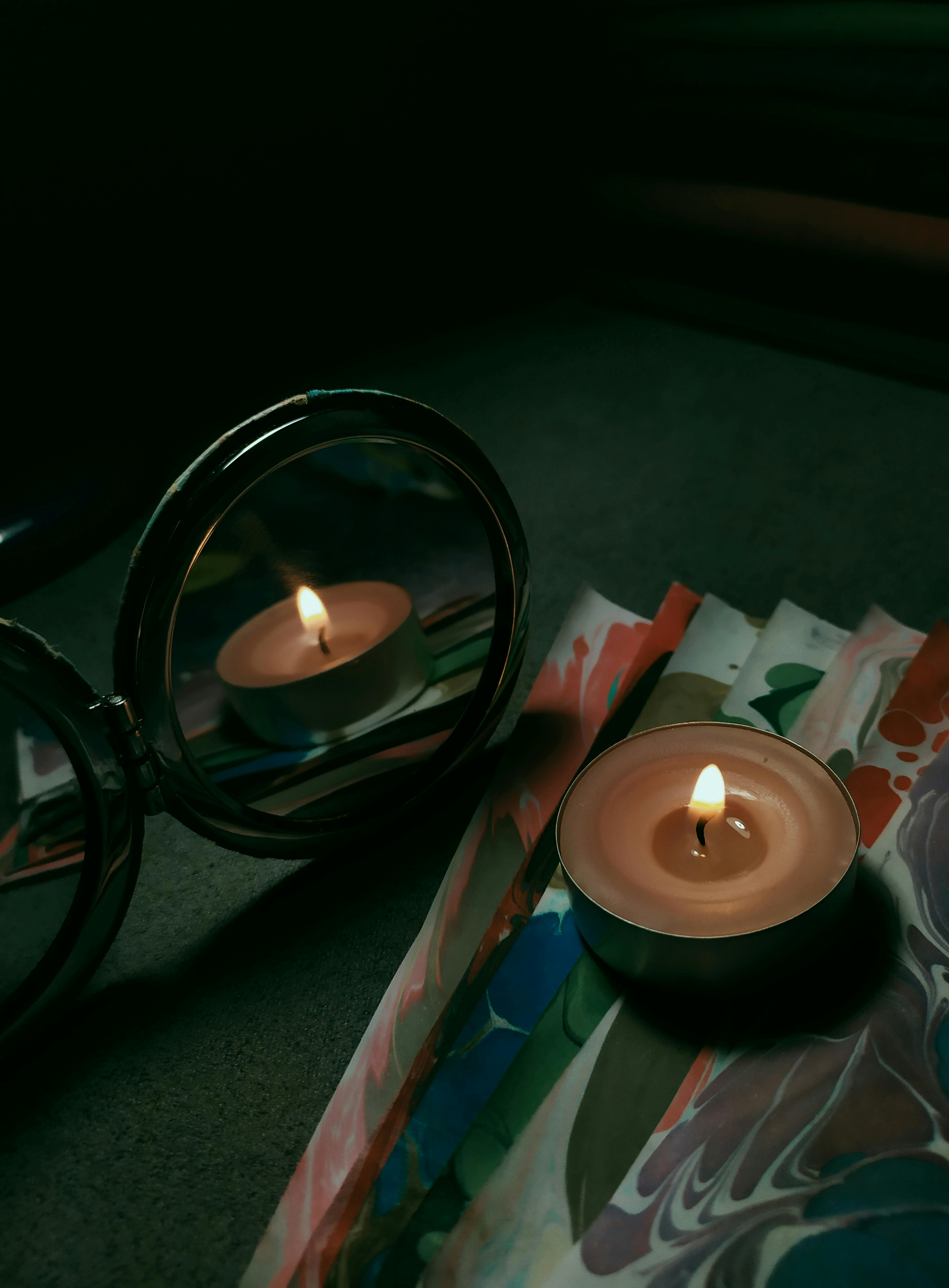 Reflective Candlelight on Colorful Surface · Free Stock Photo