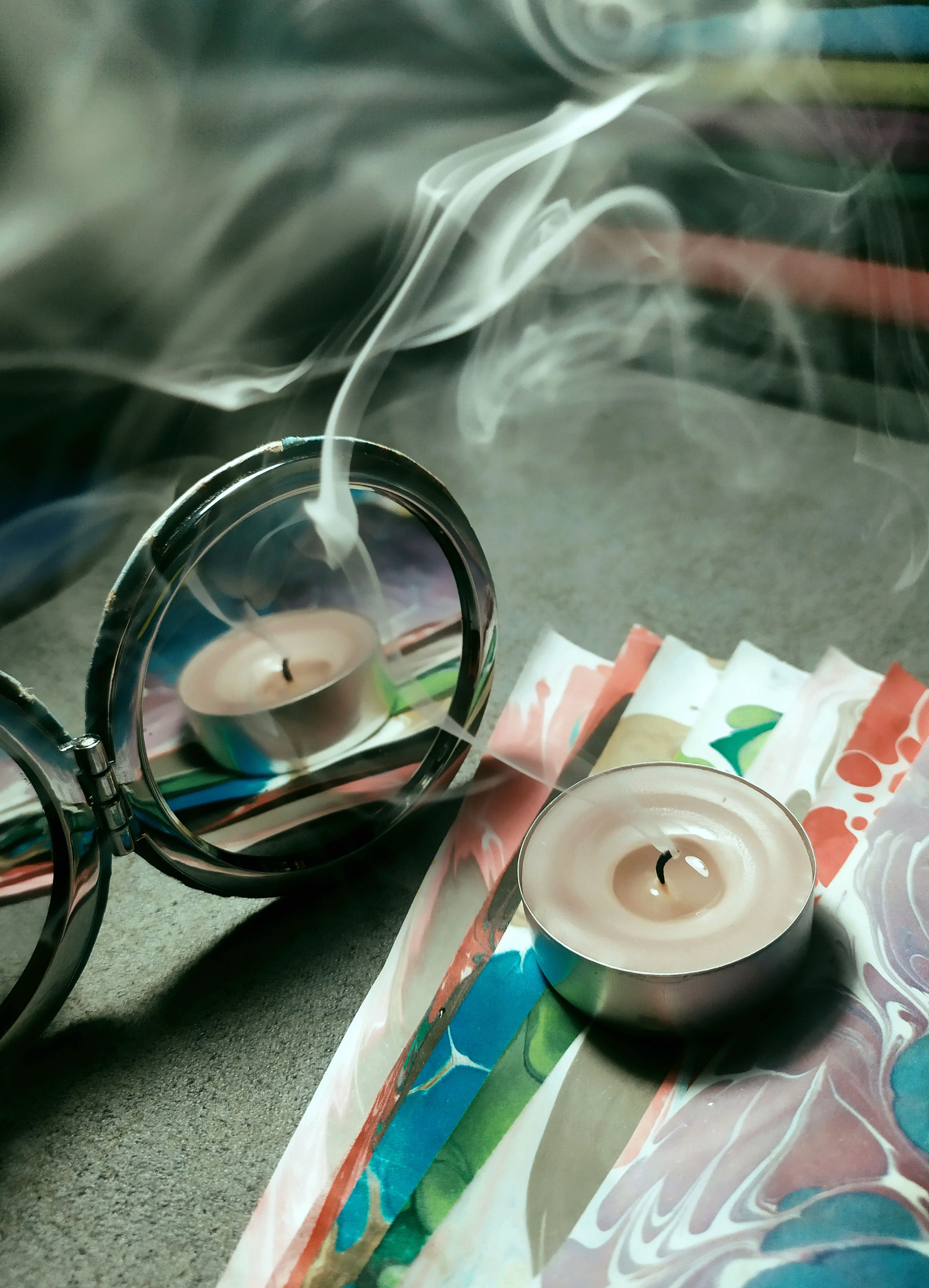 Elegant Aromatic Candle with Smoke and Mirror Reflection · Free Stock Photo