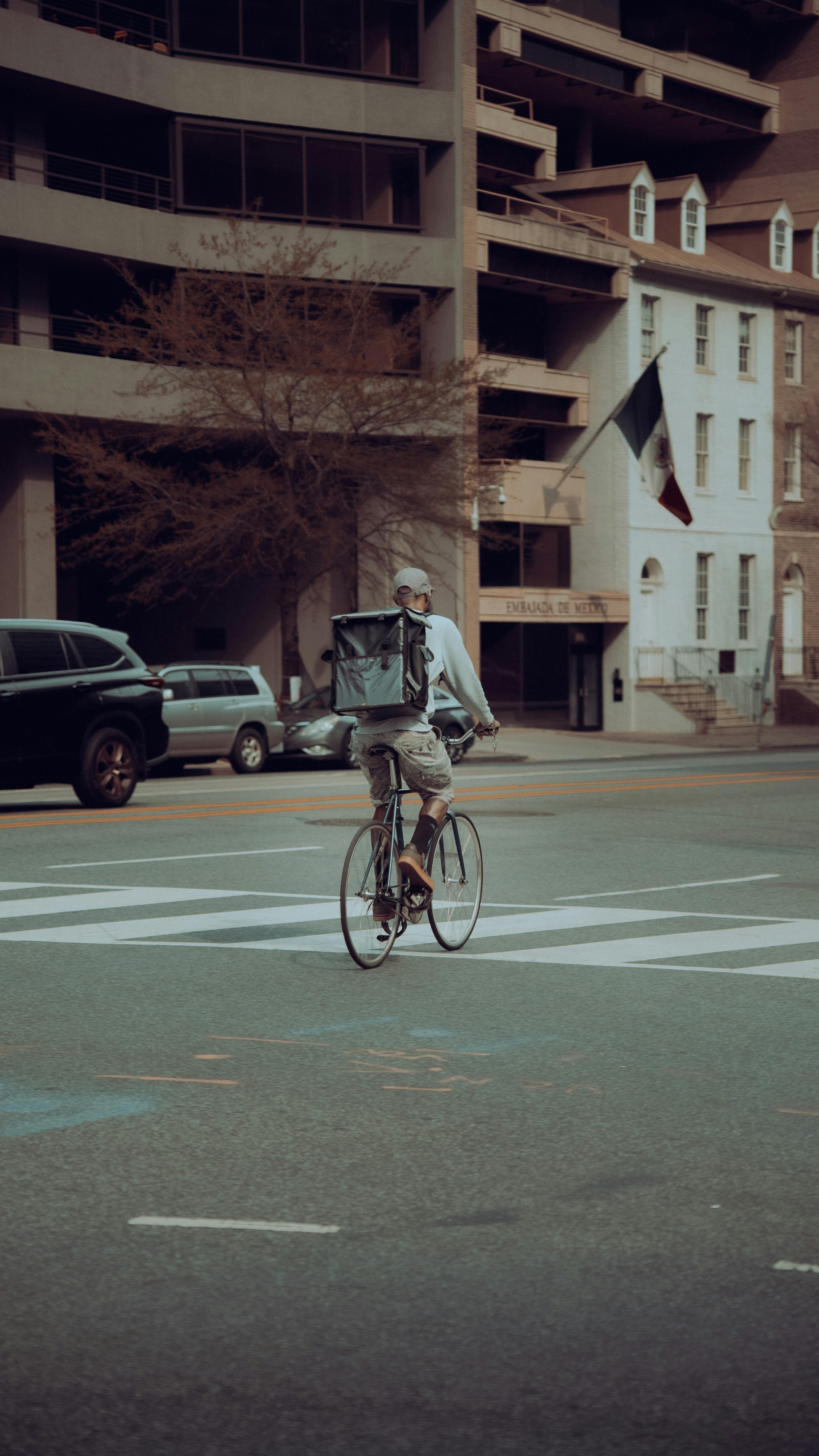 Cyclist Commuting on Washington D.C. Street · Free Stock Photo