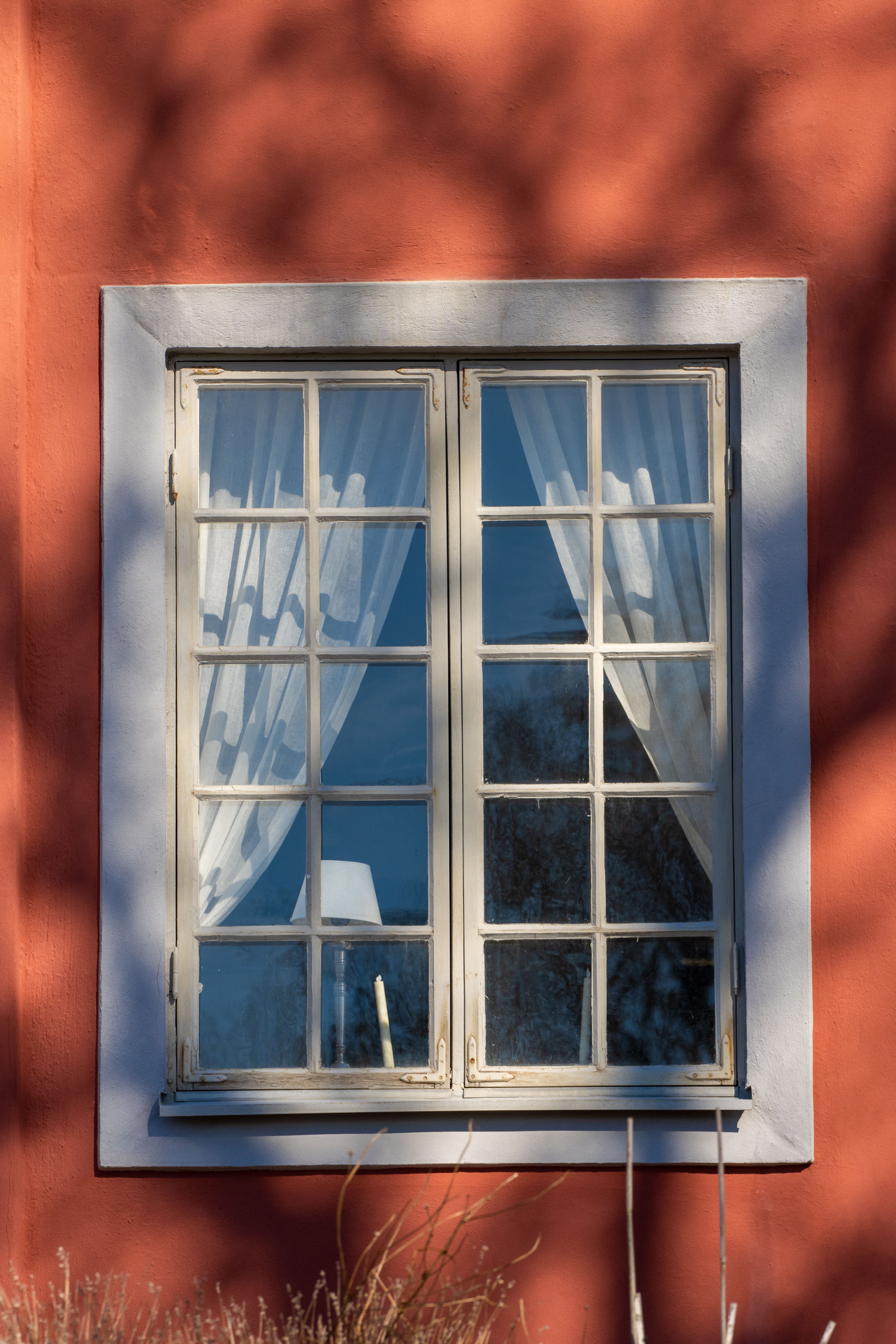 Traditional Window on Orange Wall in Sunlight · Free Stock Photo