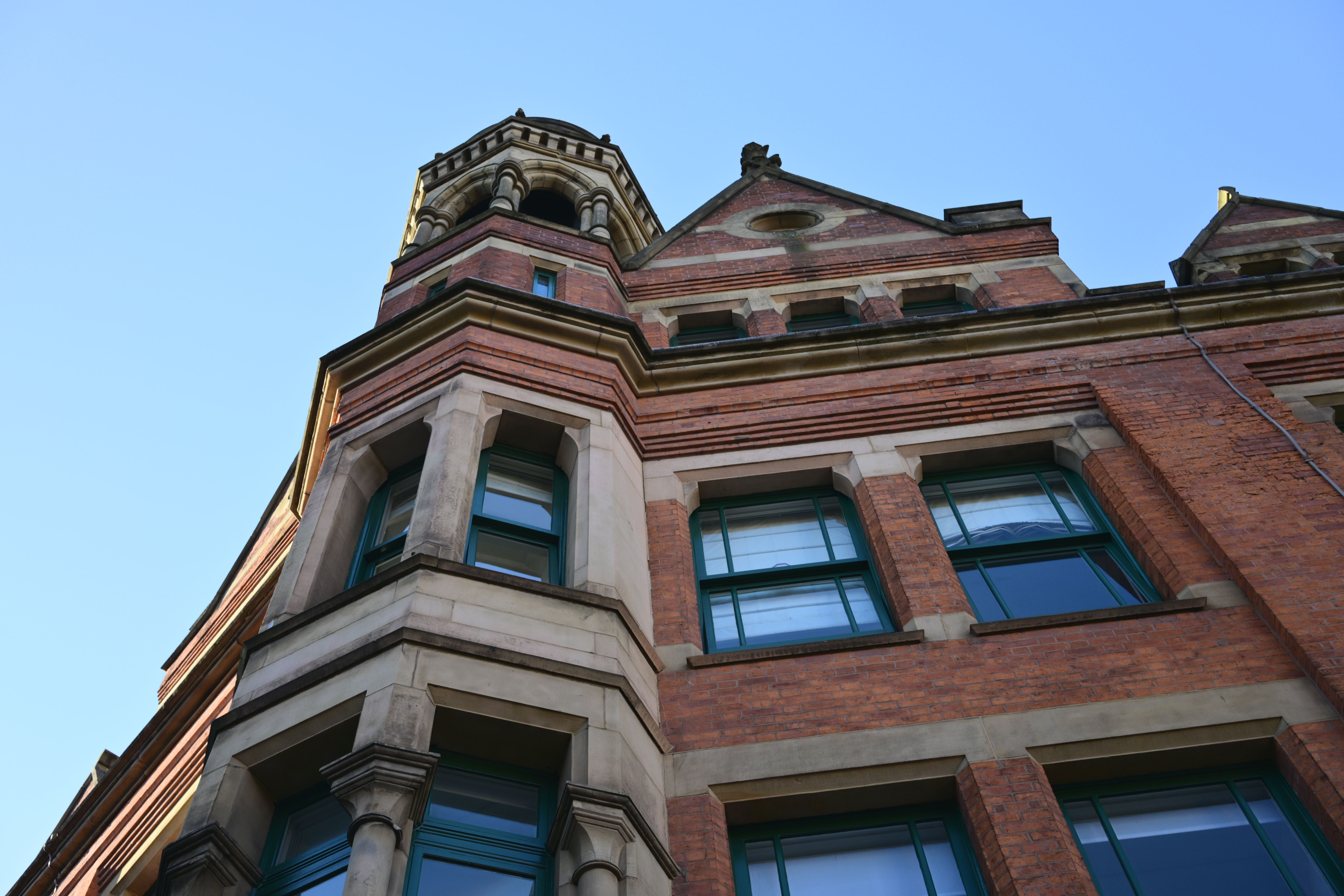 Historic Brick Architecture with Arched Windows · Free Stock Photo