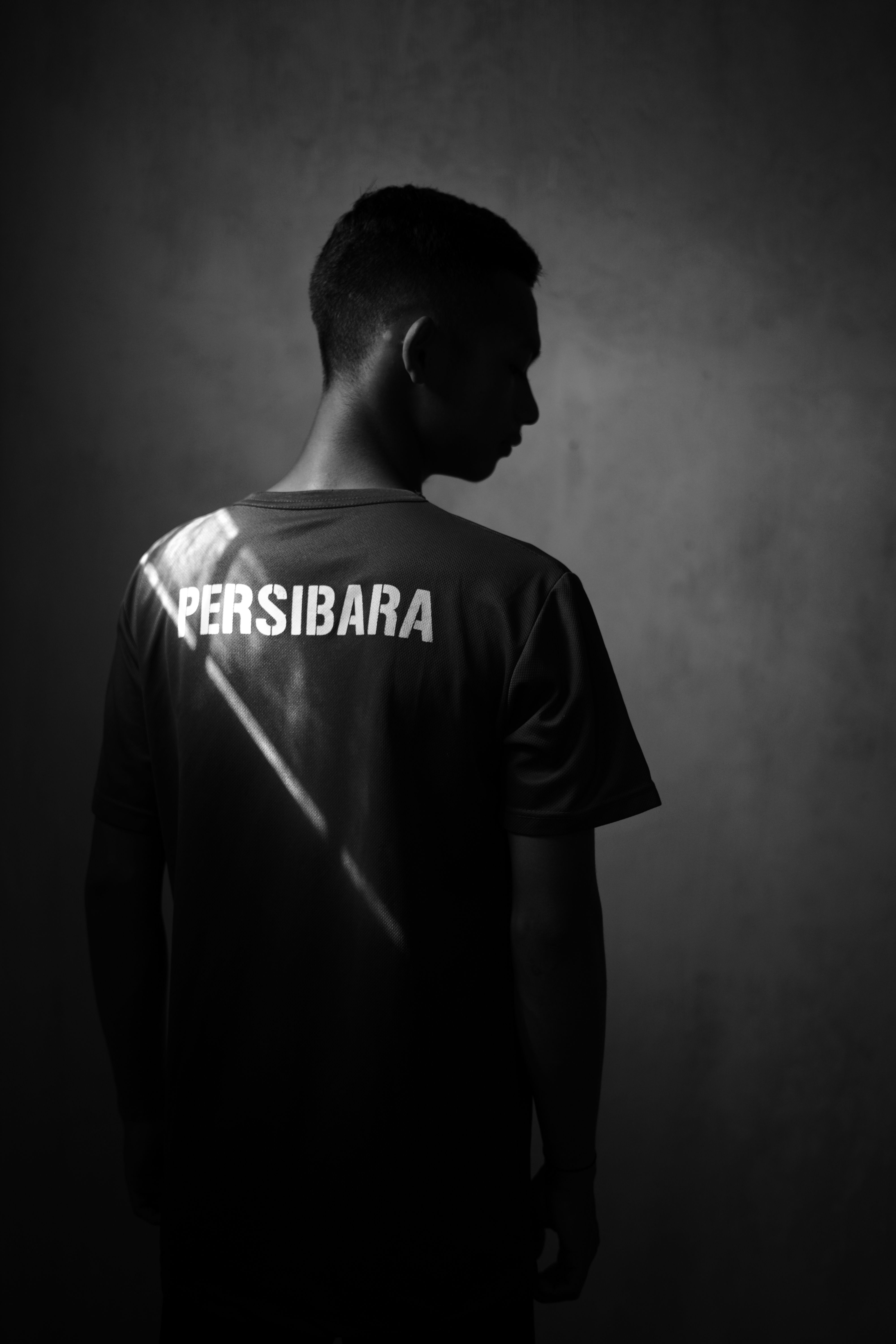 Silhouette of Young Man in Dramatic Lighting · Free Stock Photo