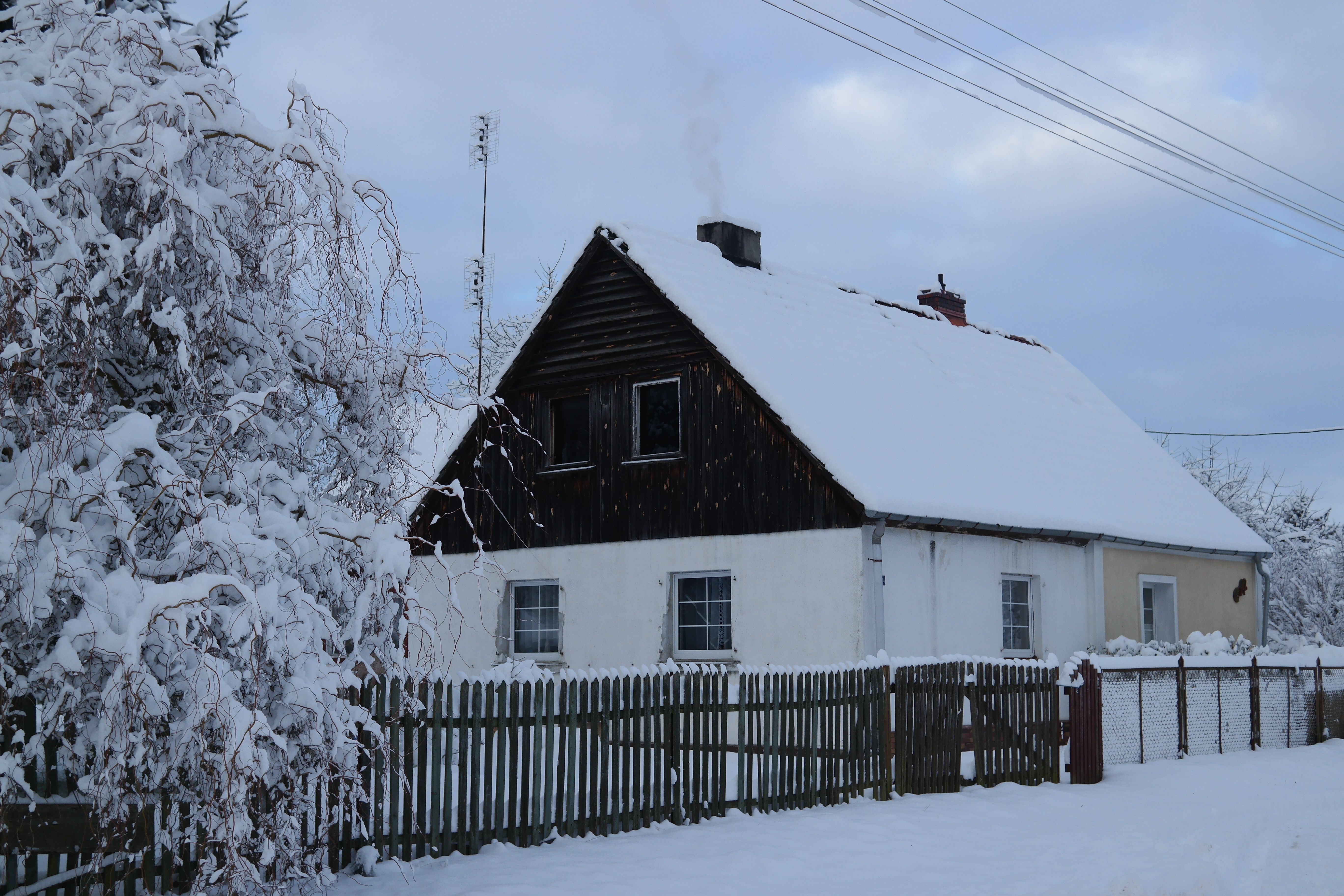 Cozy Snow-Covered Cottage in Winter Landscape · Free Stock Photo